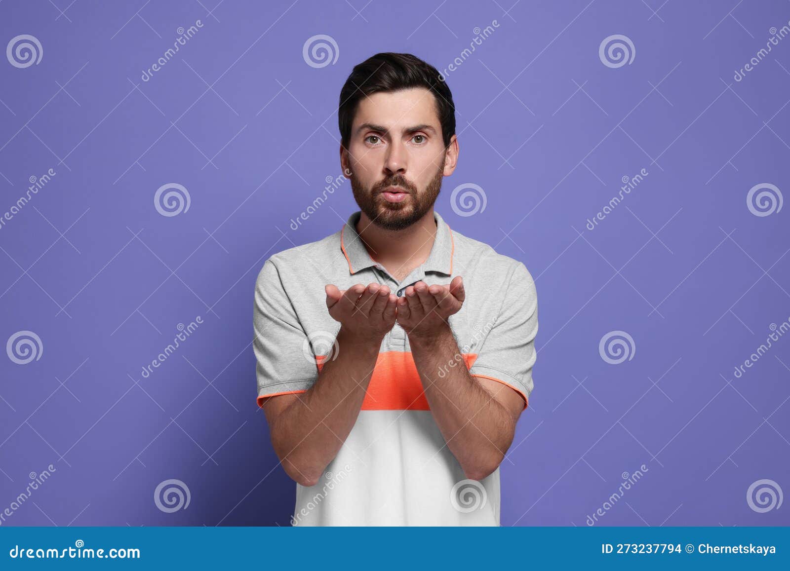 Handsome Man Blowing Kiss on Violet Background Stock Photo - Image of ...