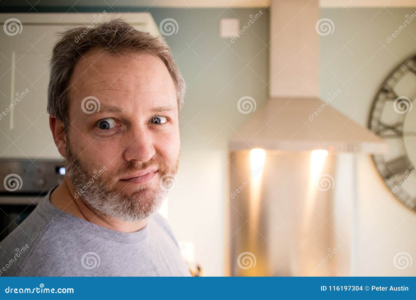 A Handsome Man with Blue Eyes Pulling a Silly Face. Stock Photo - Image ...