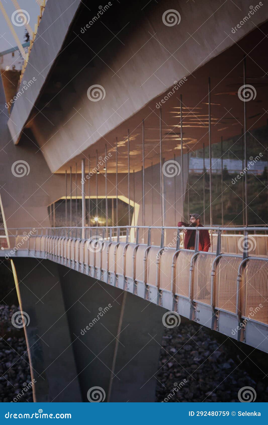 Handsome man on a bridge stock image. Image of walking - 292480759