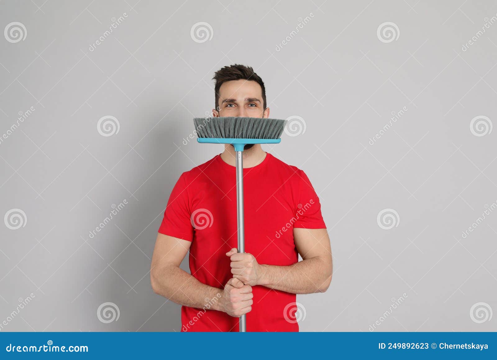 Handsome Man with Broom on Grey Background Stock Image - Image of ...