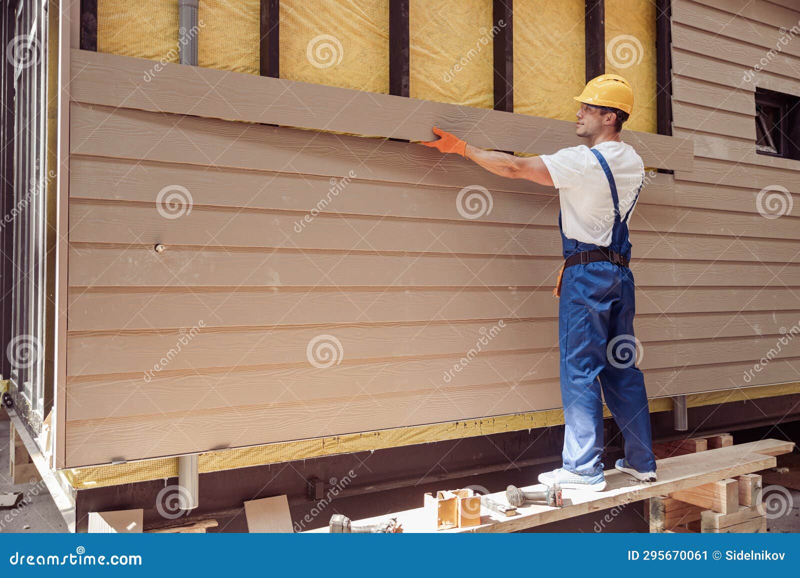 Handsome Man Builder Building Cabin at Construction Site Stock Image ...