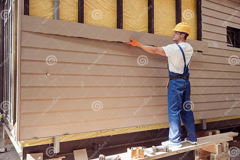 Handsome Man Builder Building Cabin at Construction Site Stock Image ...