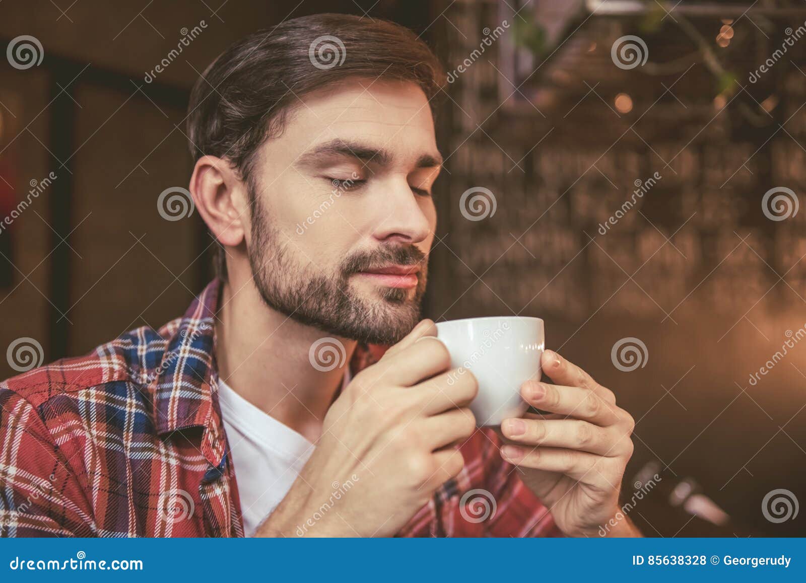 Handsome man at the cafe stock photo. Image of coffee - 85638328