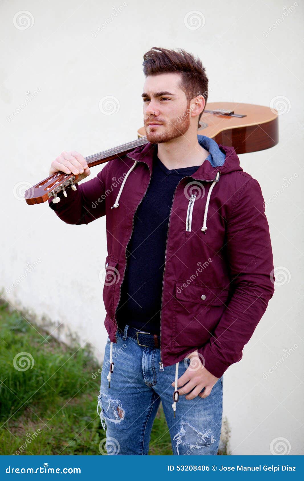 Handsome Man Carrying a Guitar on His Shoulders Stock Photo - Image of ...