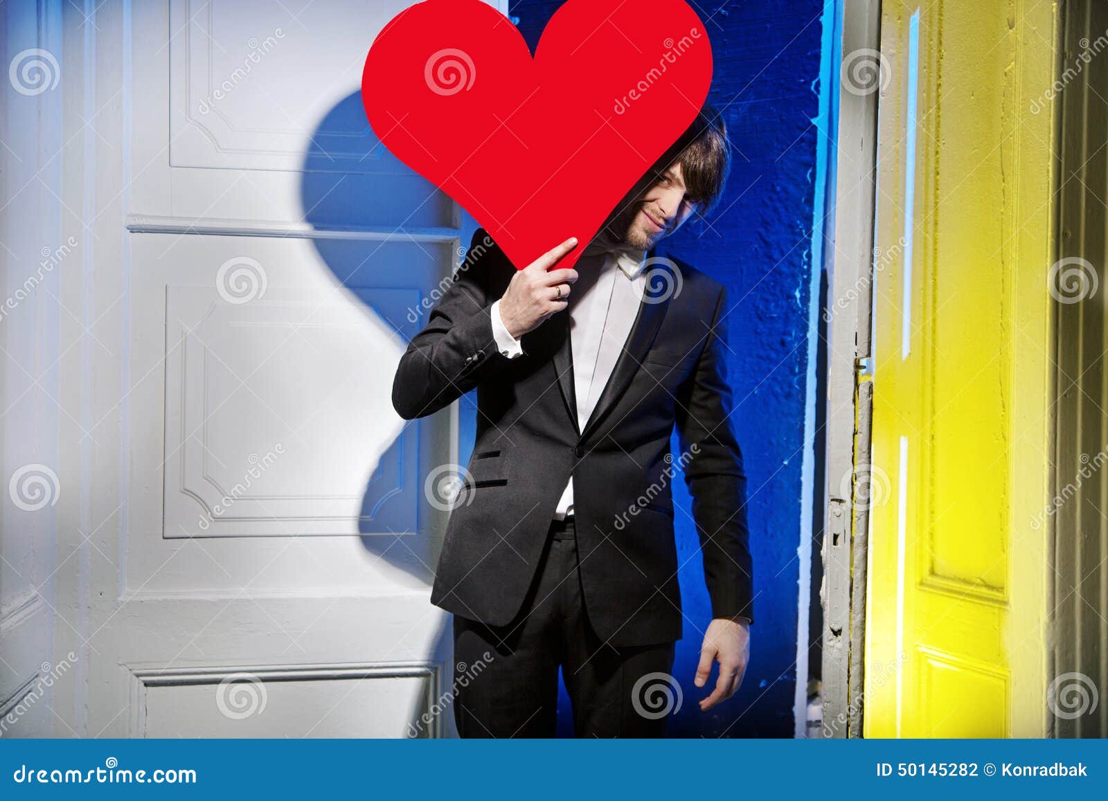 Handsome Man Carrying a Large Heart Stock Photo - Image of couch ...