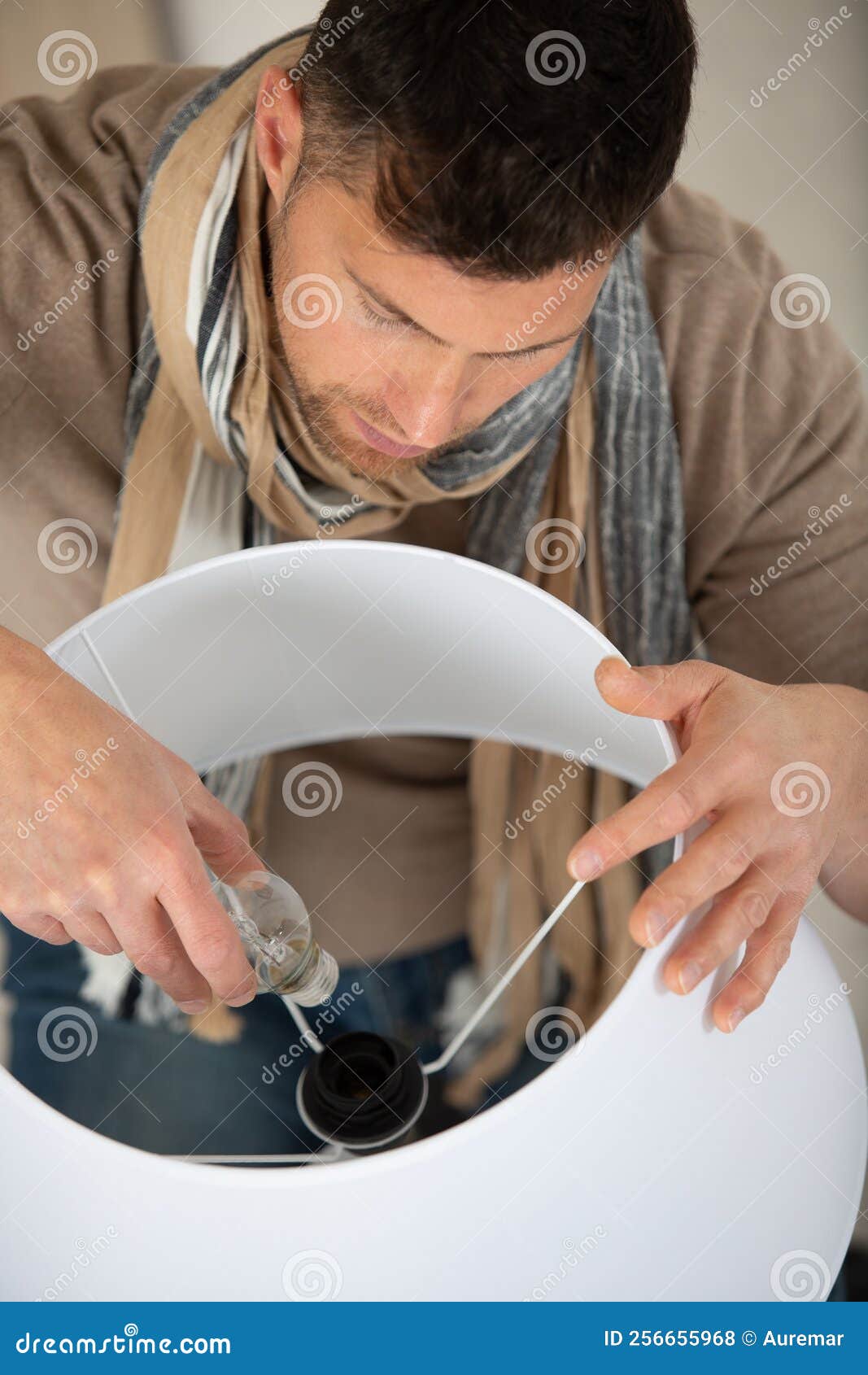 Handsome Man Changing Light Bulb Stock Photo - Image of changing ...