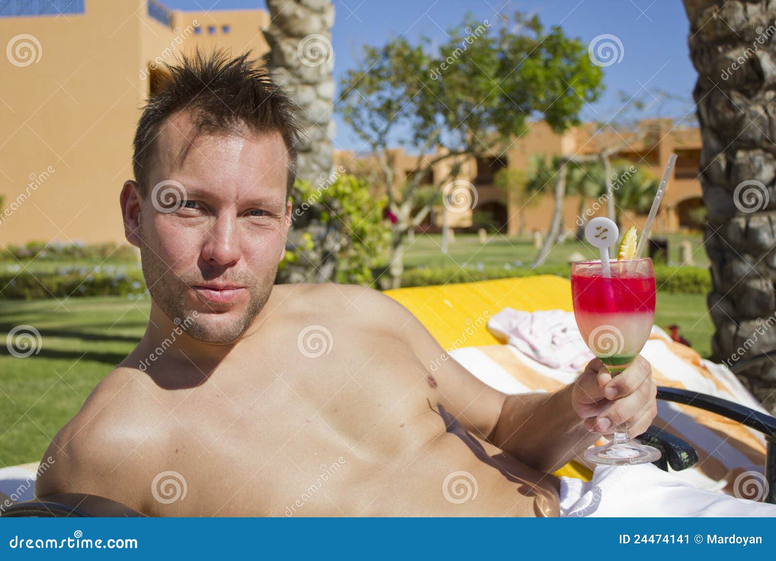 Handsome man with cocktail stock image. Image of colorful - 24474141