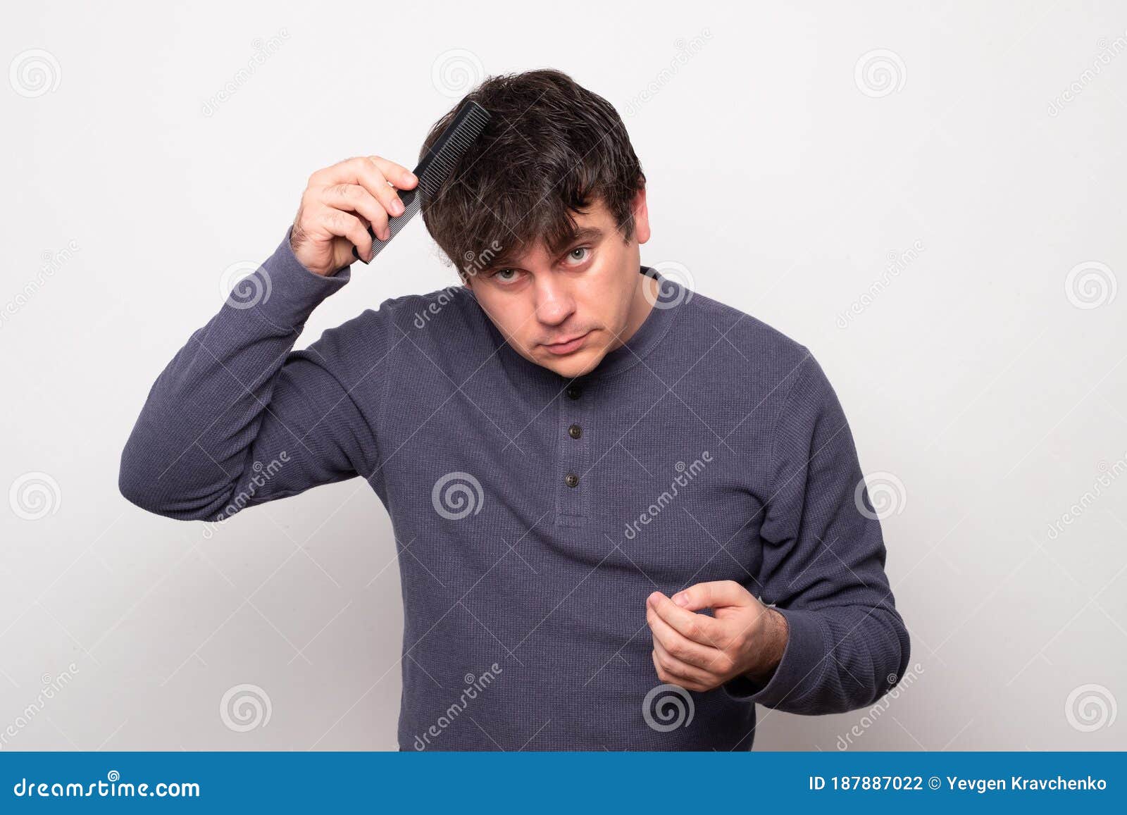 Handsome Man Combing His Hair. Caucasian Man Stock Photo - Image of ...