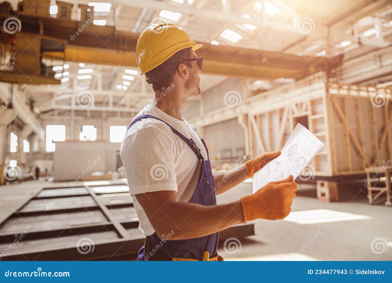 Architect Working at House Building Construction Site with Blueprint ...