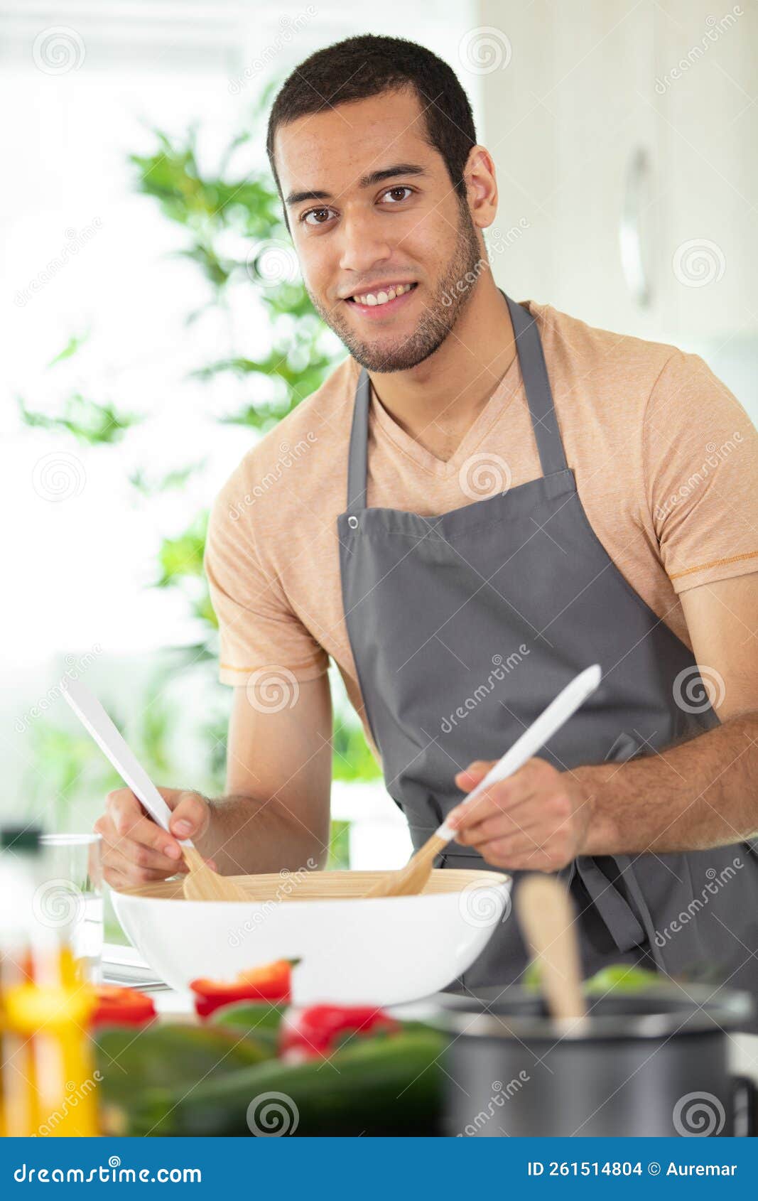 Handsome Man Cooking at Home Preparing Salad in Kitchen Stock Photo ...