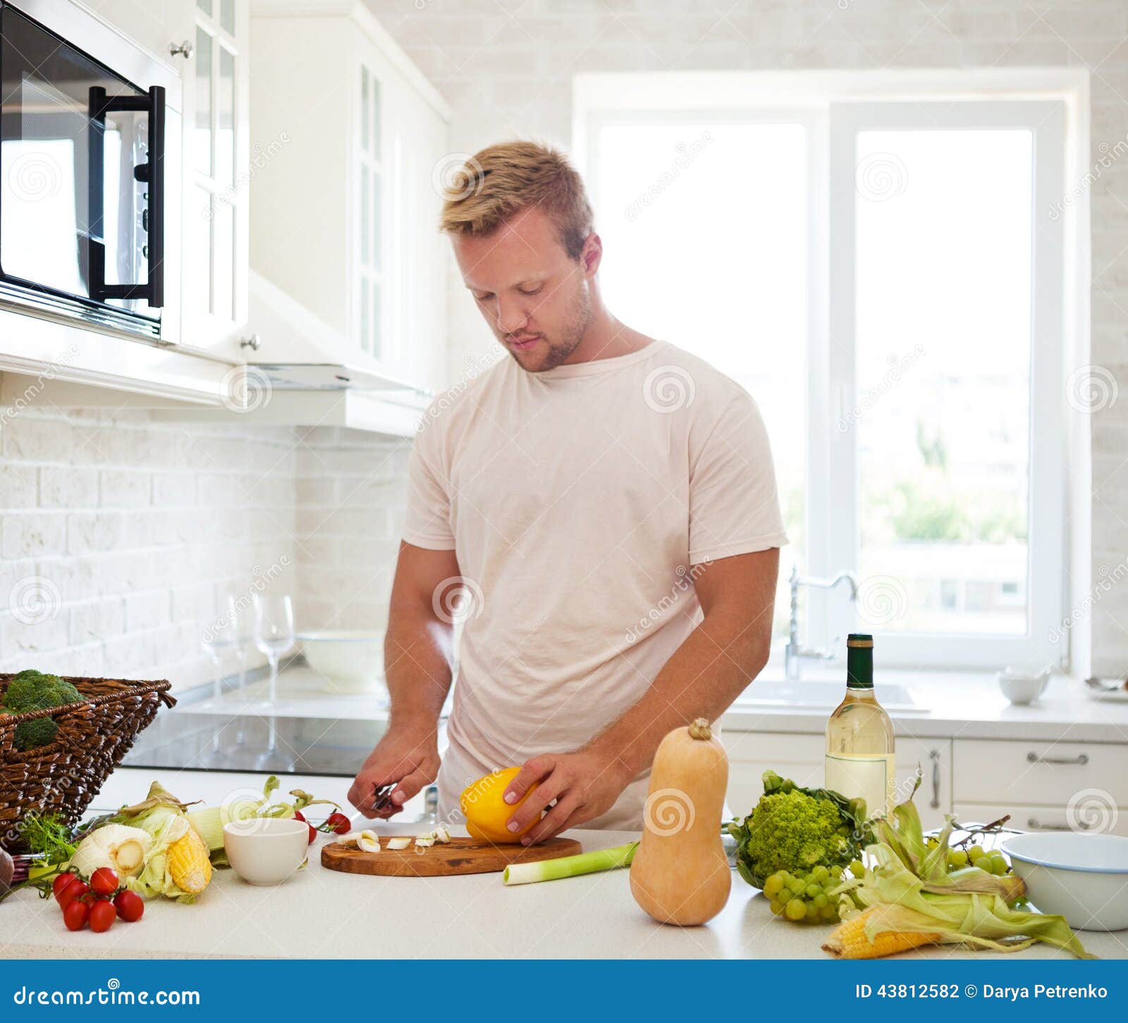 Handsome Man Cooking at Home Preparing Salad in Kitchen Stock Photo ...