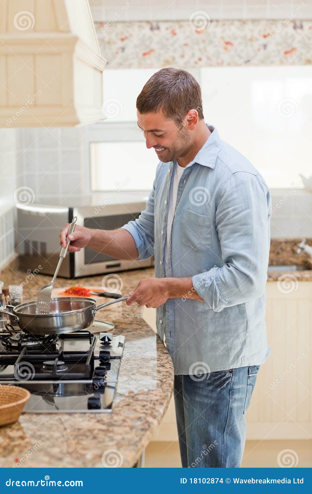 Handsome Man Cooking In The Kitchen Stock Images - Image: 18102874