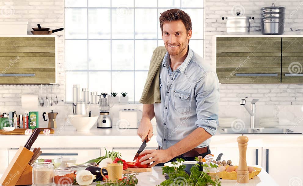 Handsome Man Cooking in Kitchen at Home Stock Photo - Image of indoors ...
