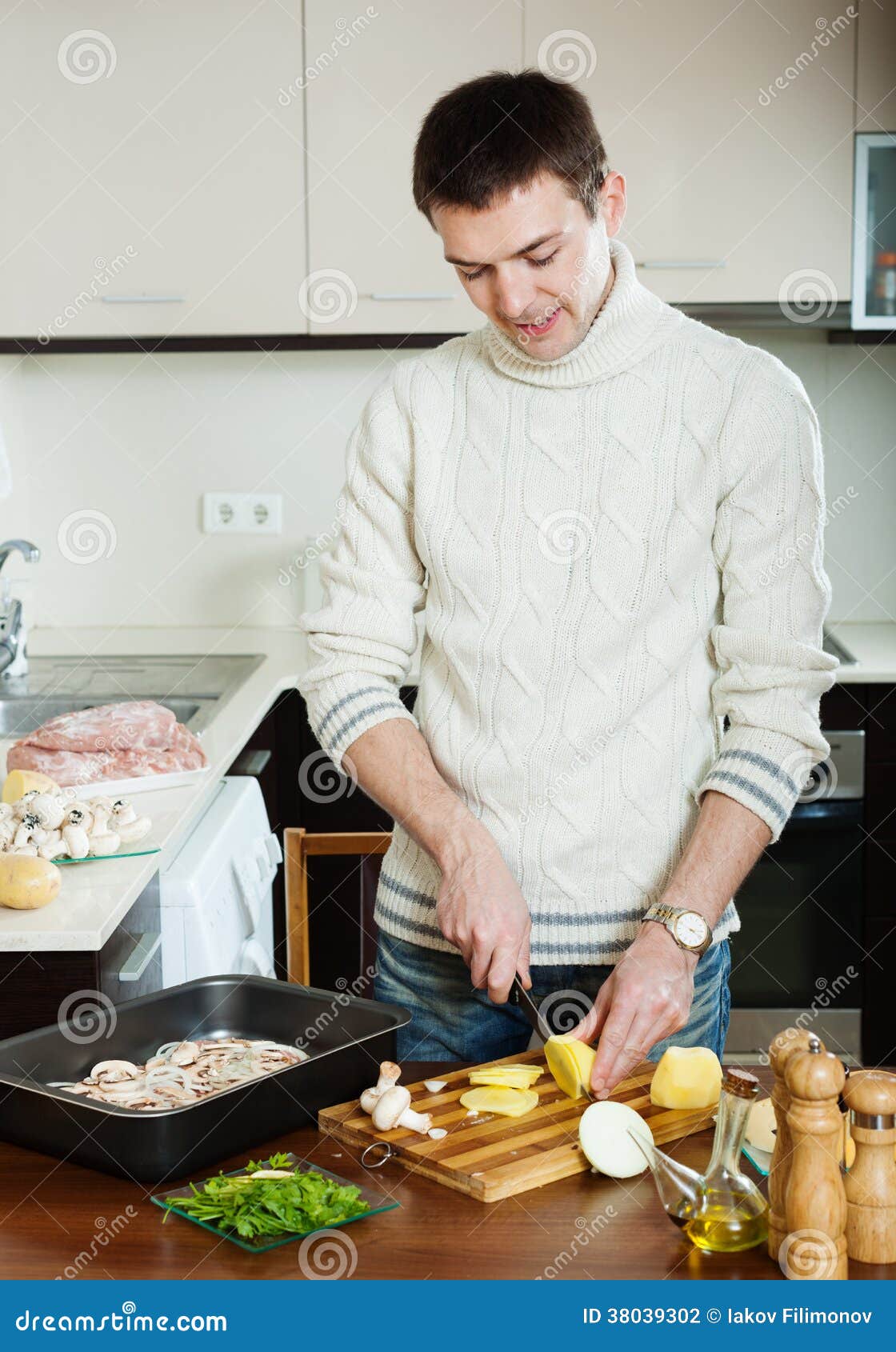Handsome Man Cooking Meat with Mushrooms and Potatoes Stock Photo ...