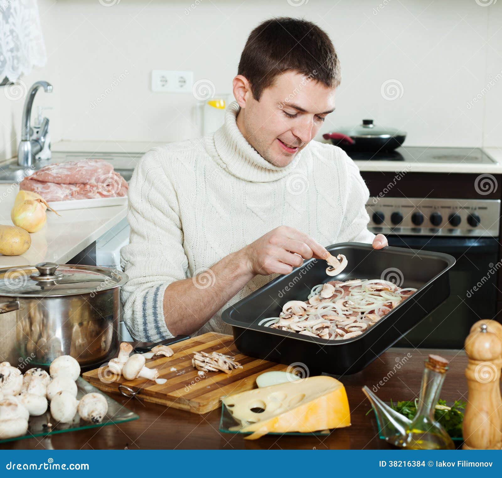 Handsome Man Cooking Meat with Mushrooms Stock Photo - Image of ...