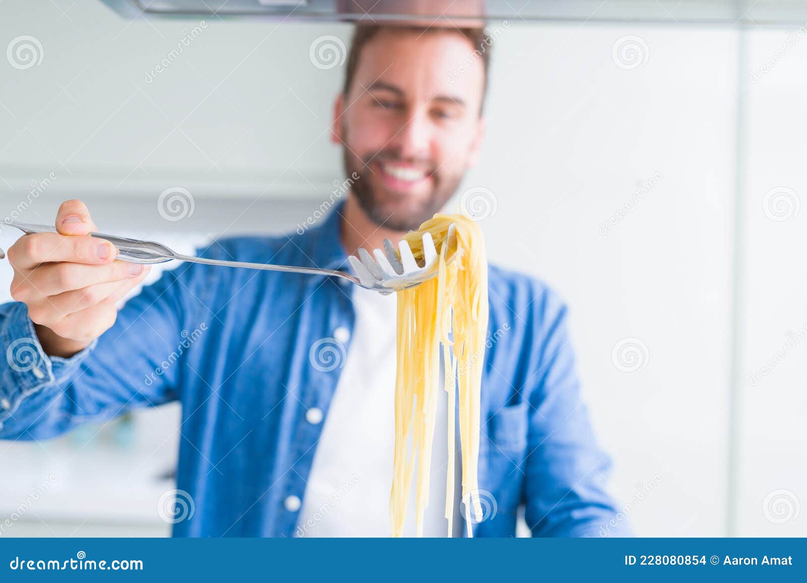 Handsome Man Cooking Pasta at Home Stock Photo - Image of dinner, beard ...