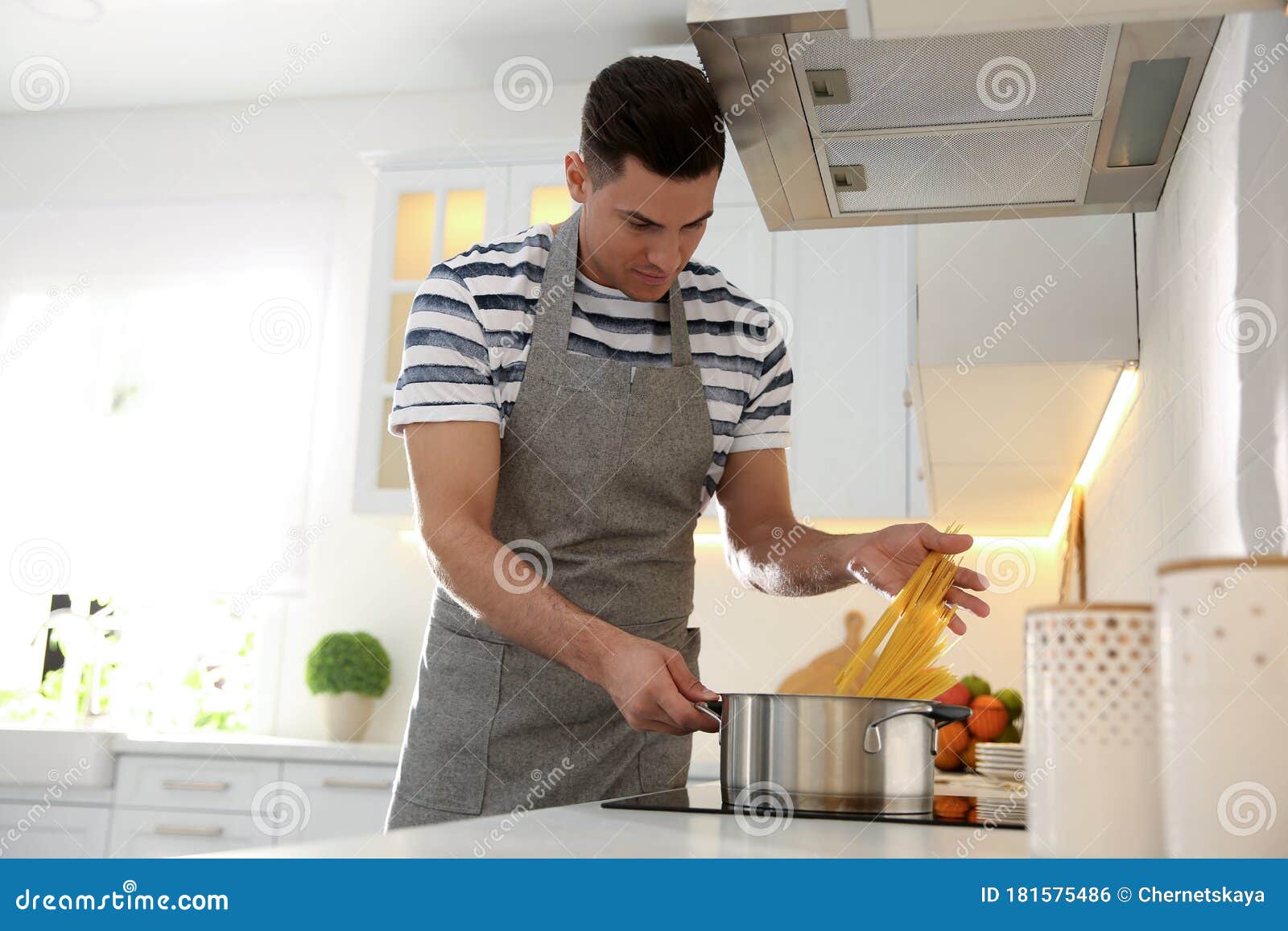 Handsome Man Cooking Pasta on Stove Stock Photo - Image of dish, meal ...