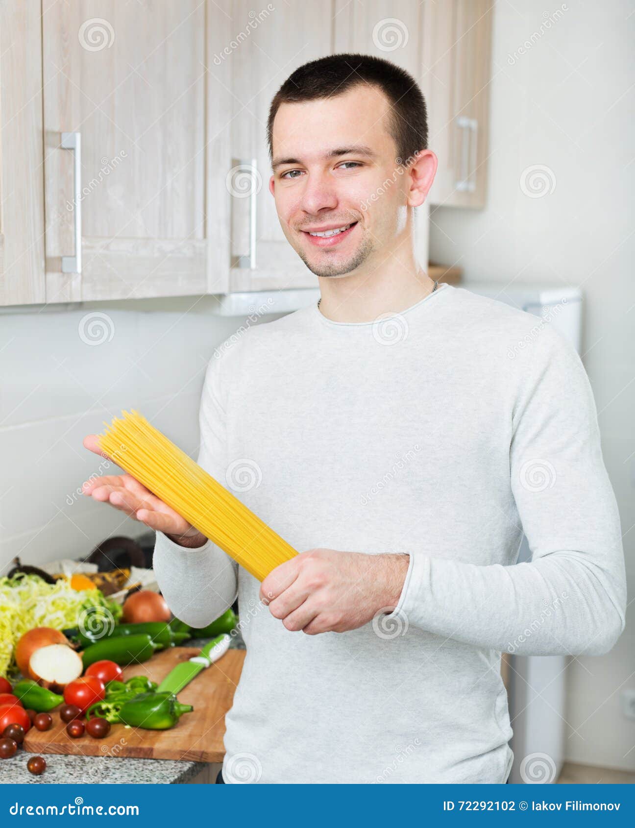 Handsome Man Cooks Spaghetti Stock Photo - Image of hobby, diet: 72292102