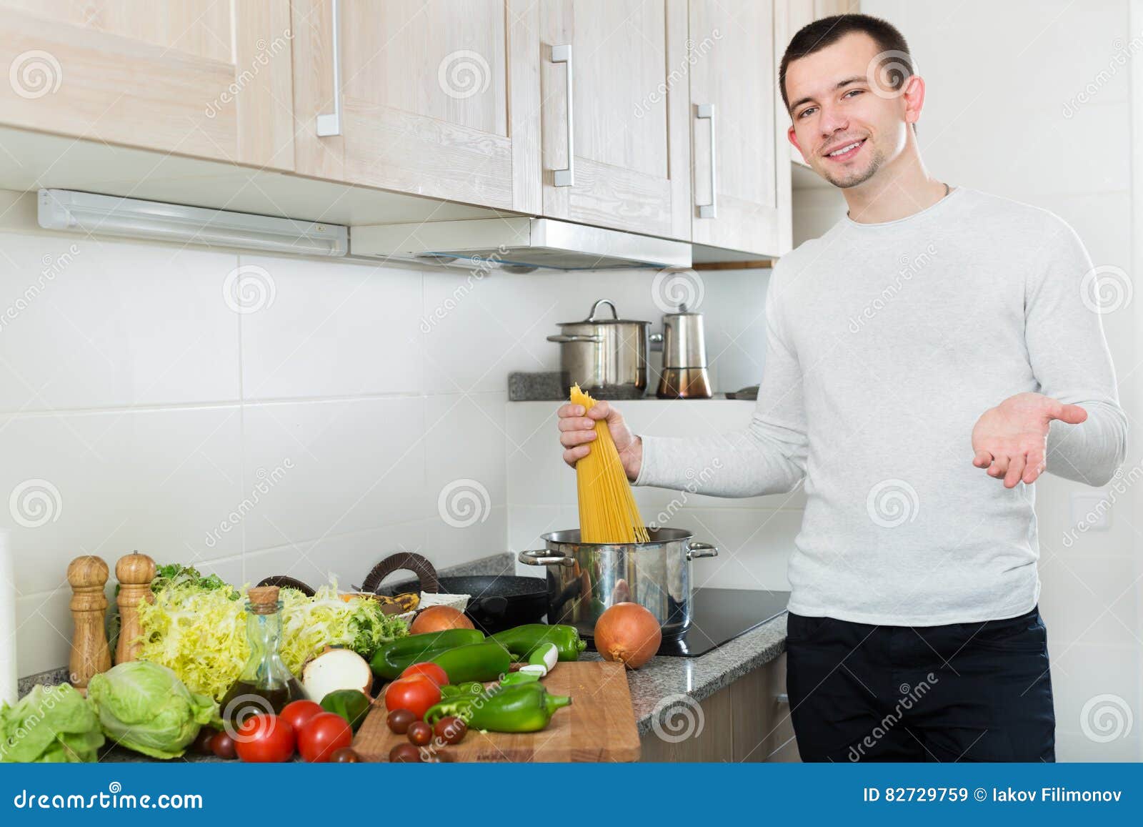 Handsome Man Cooks Spaghetti Stock Image - Image of onion, macaroni ...