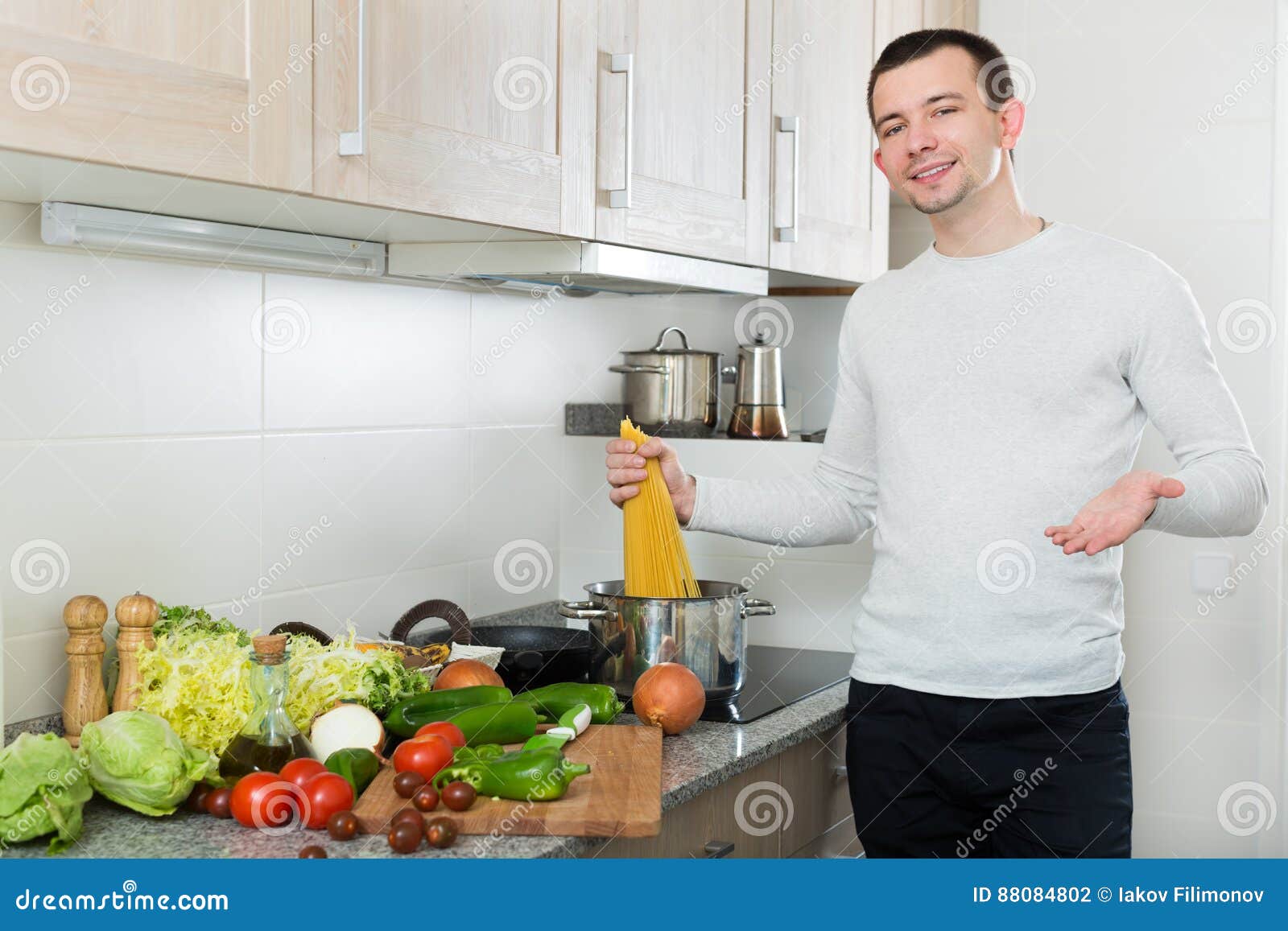 Handsome Man Cooks Spaghetti Stock Photo - Image of domestic, natural ...