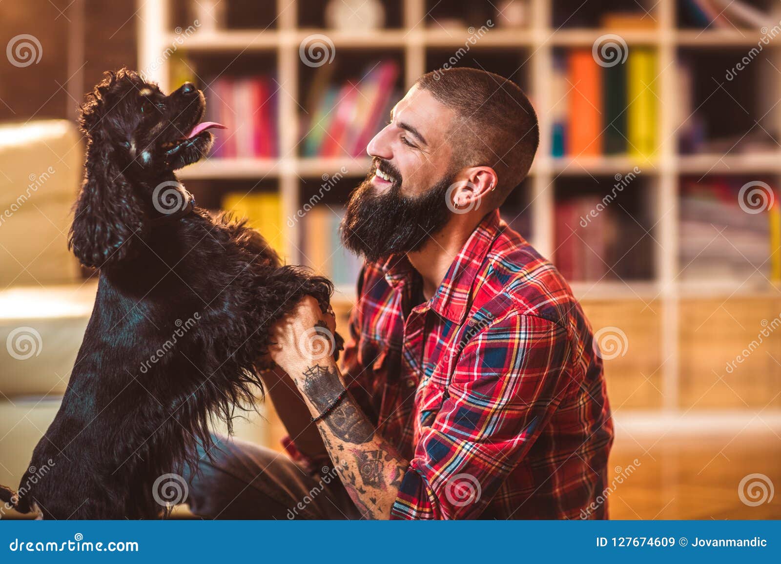 Man with cute dog at home stock image. Image of animal - 127674609