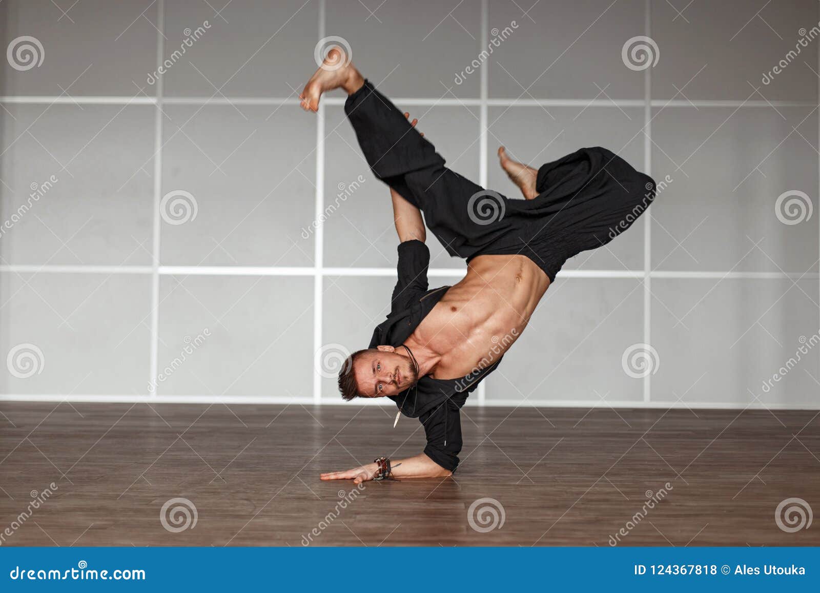 Handsome Man Dancer Dancing. Man Stands on Hands in a Dance Stock Photo ...