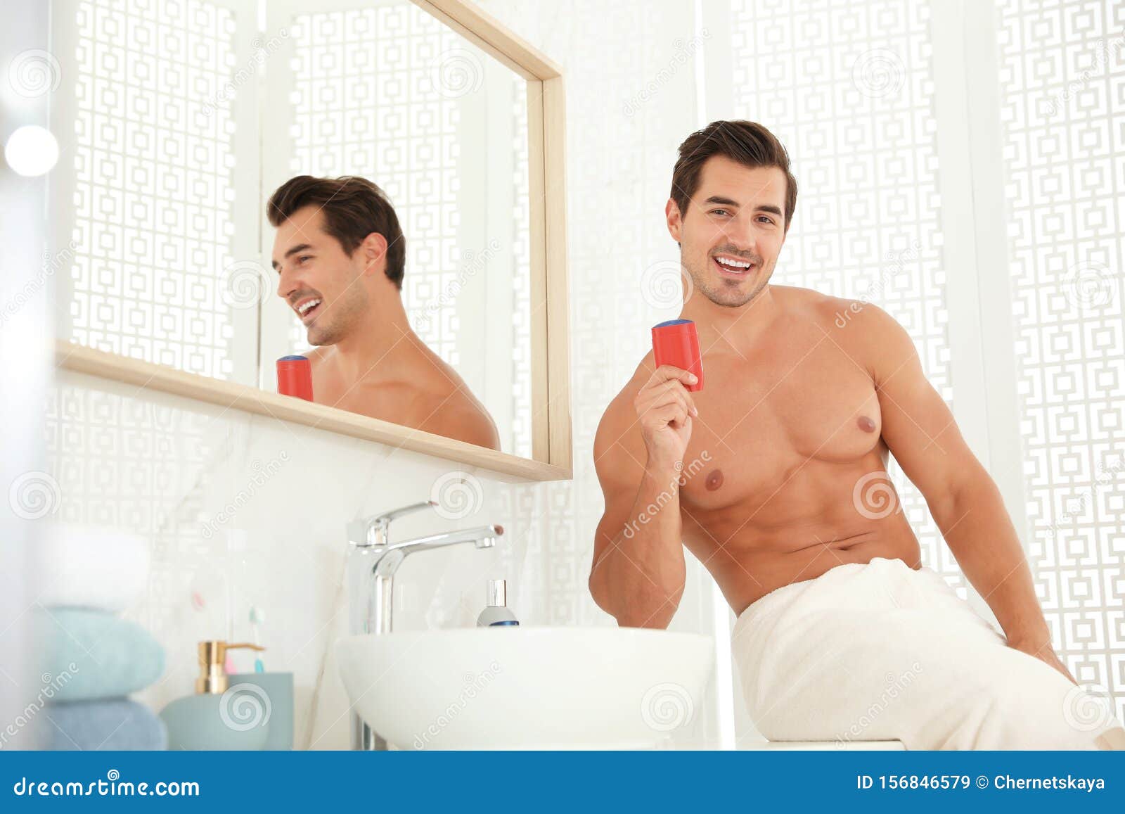 Handsome Man with Deodorant in Bathroom Stock Image - Image of ...