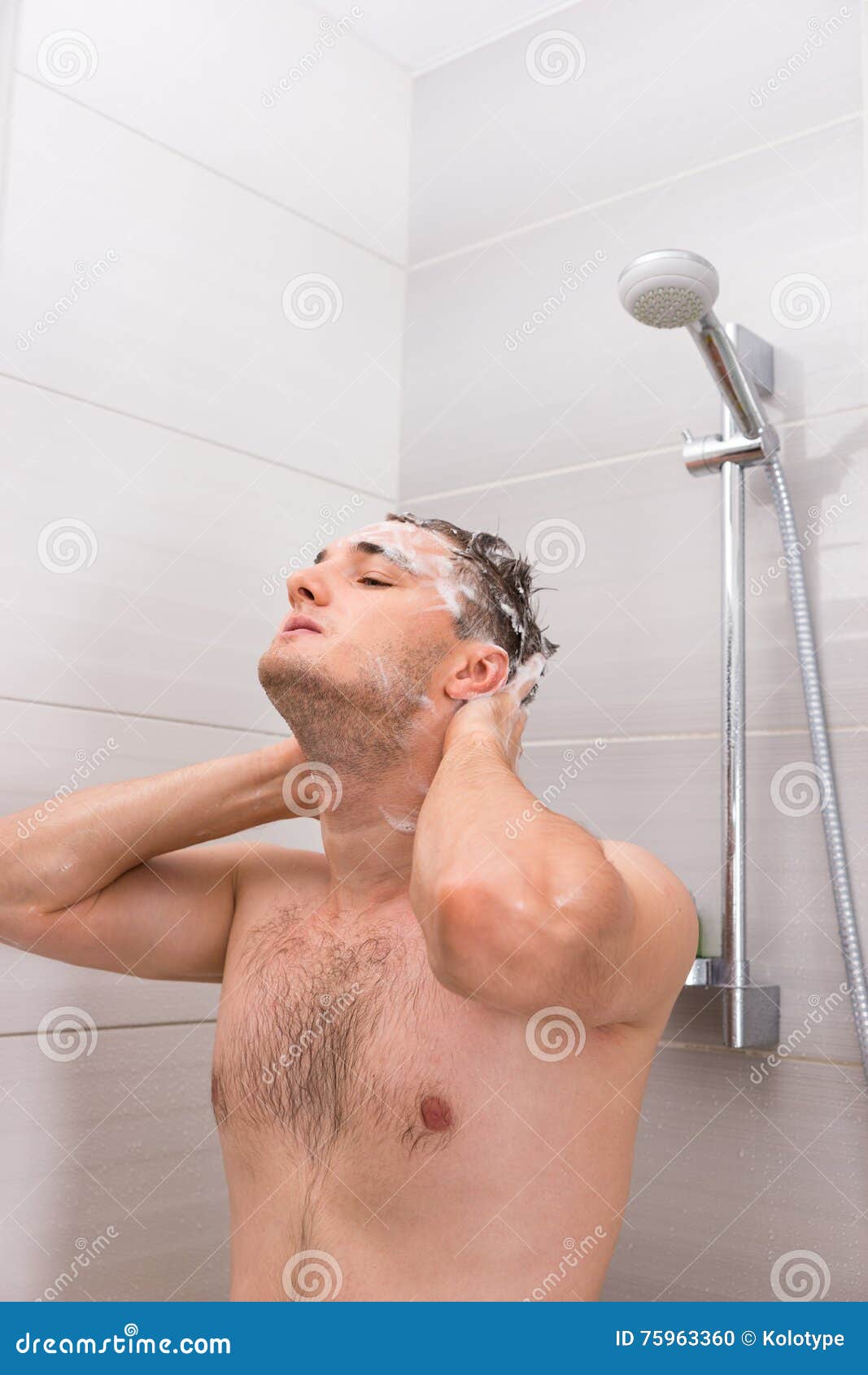 Handsome Man Diligently Washing His Hair In Shower Cabin In The Stock