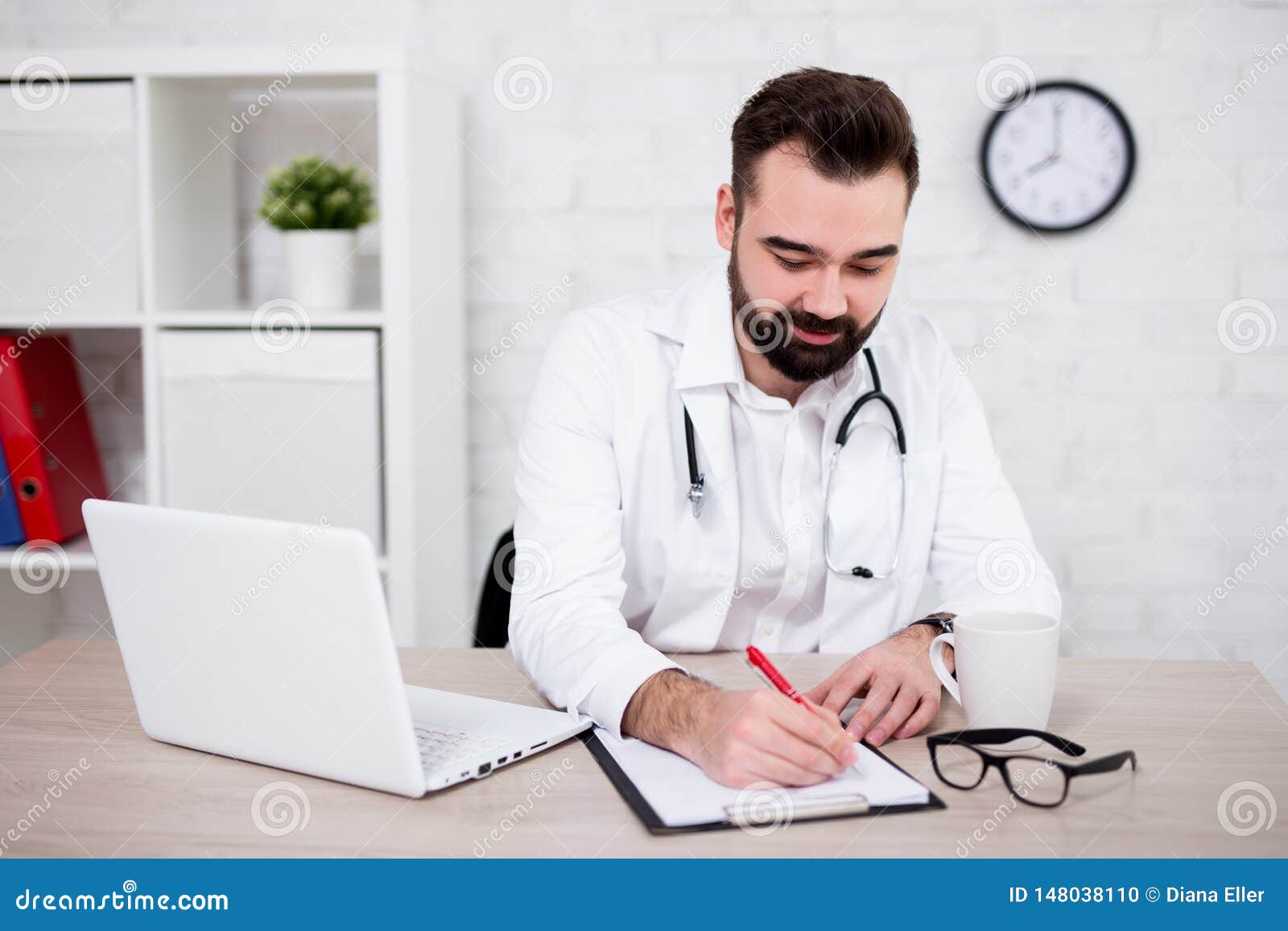 Handsome Man Doctor Doing Paperwork in Office Stock Photo - Image of ...