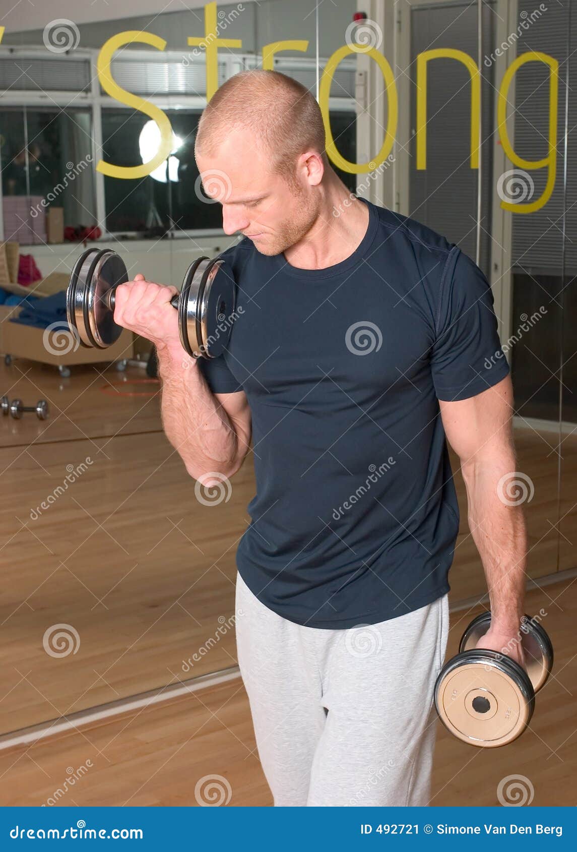 Handsome Man Doing Biceps Curls Stock Image - Image of goodlooking ...