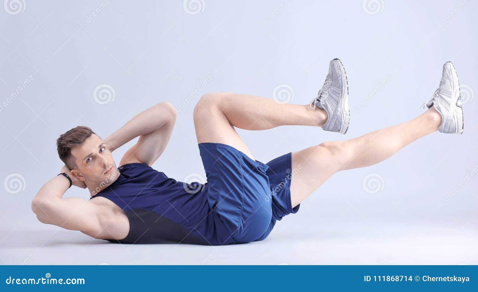 Handsome Man Doing Bicycle Crunch Stock Photo - Image of activity ...