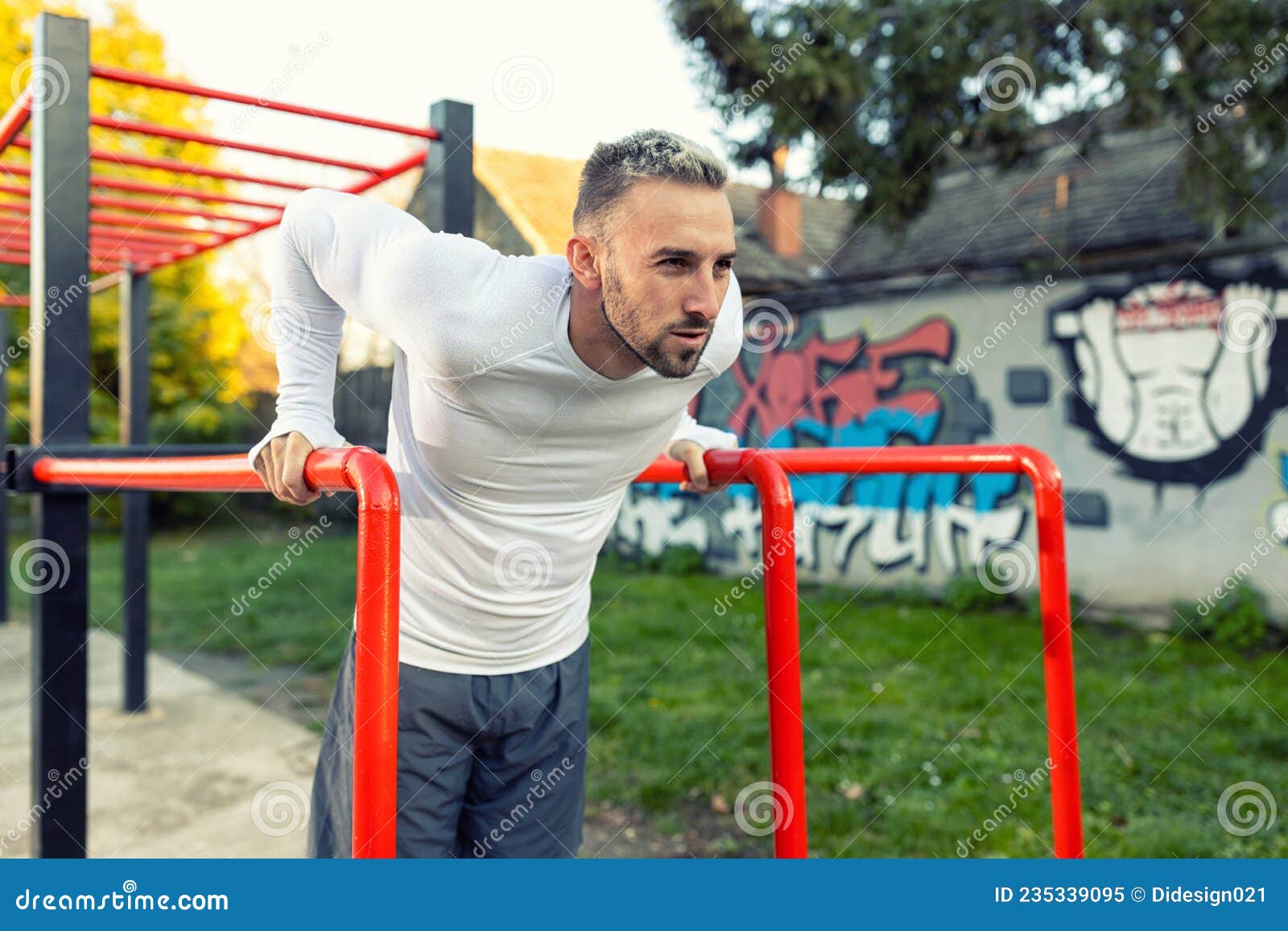Handsome Man Doing Dips on Parallel Bars Boosting His Chest Muscles ...