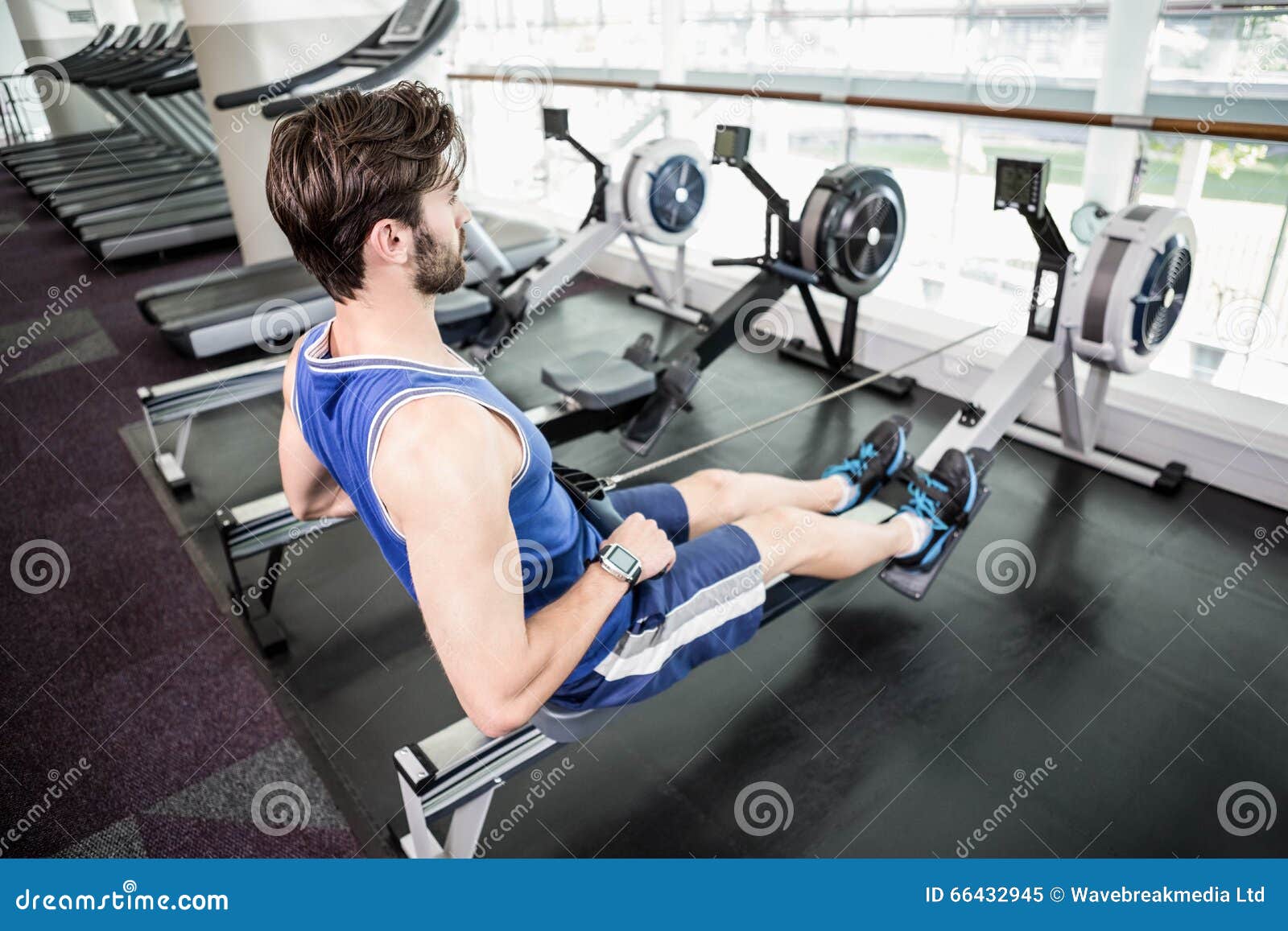 Handsome Man Doing Exercise on Drawing Machine Stock Image - Image of ...