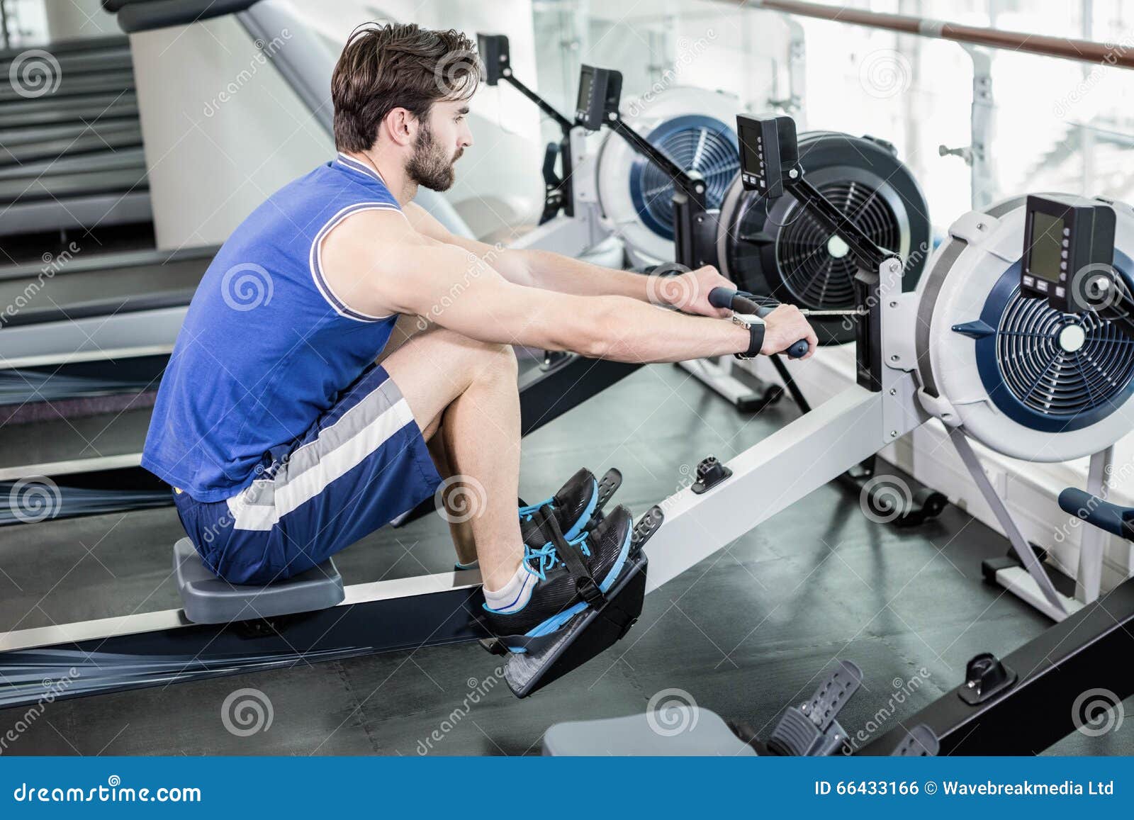 Handsome Man Doing Exercise on Drawing Machine Stock Photo - Image of ...