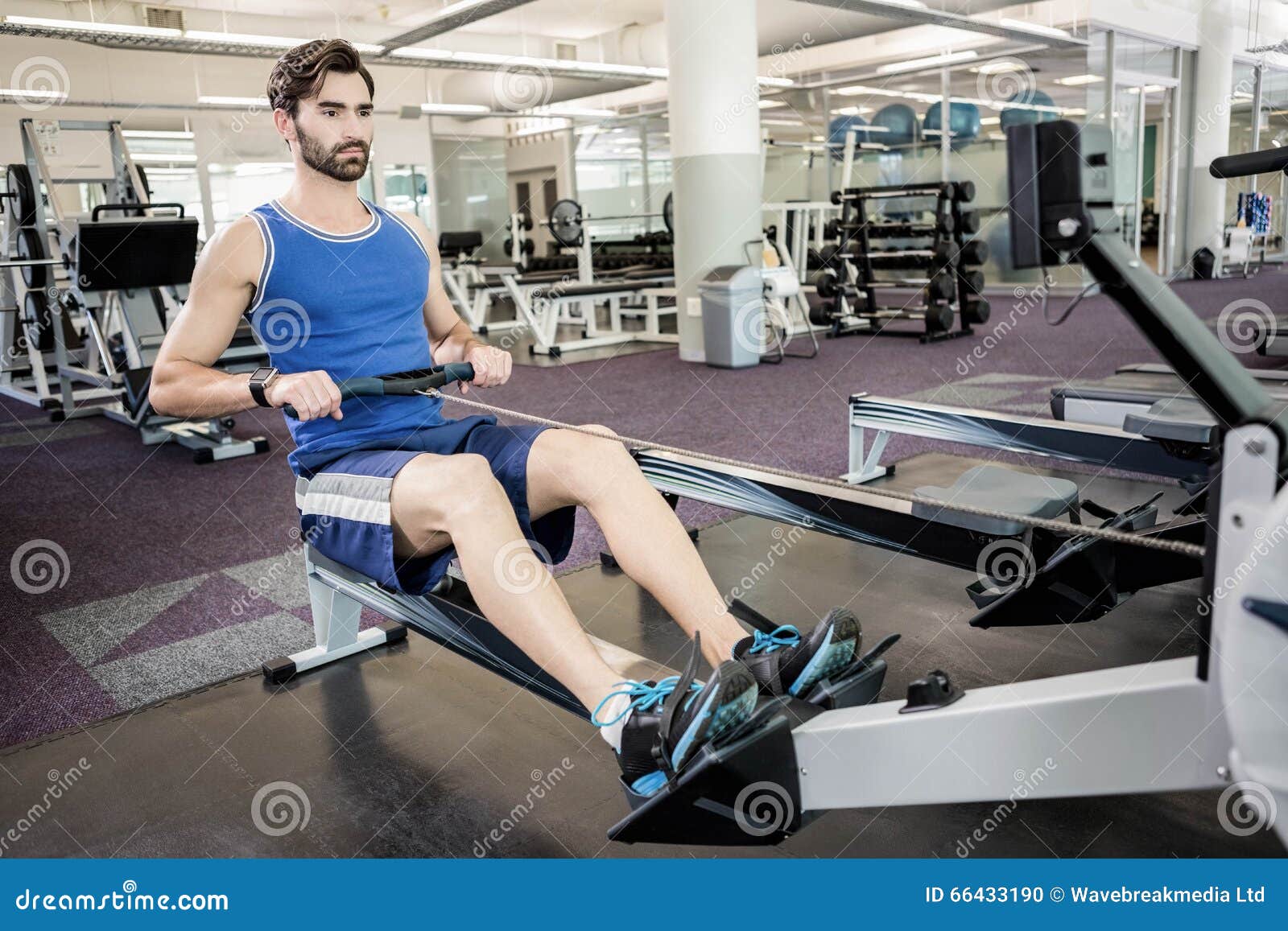 Handsome Man Doing Exercise on Drawing Machine Stock Photo - Image of ...