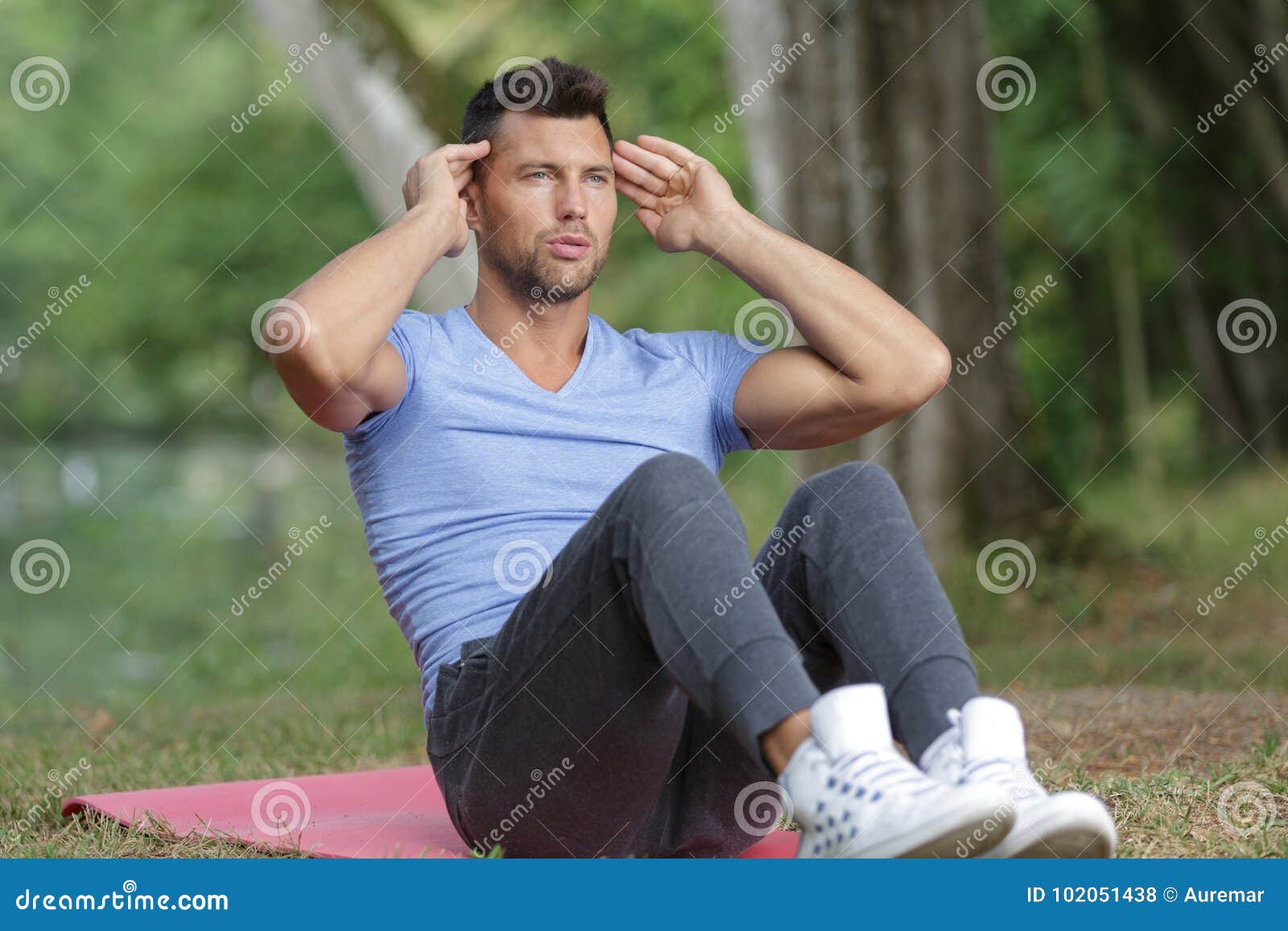 Handsome Man Doing Sit-ups in Forest Stock Photo - Image of healthy ...