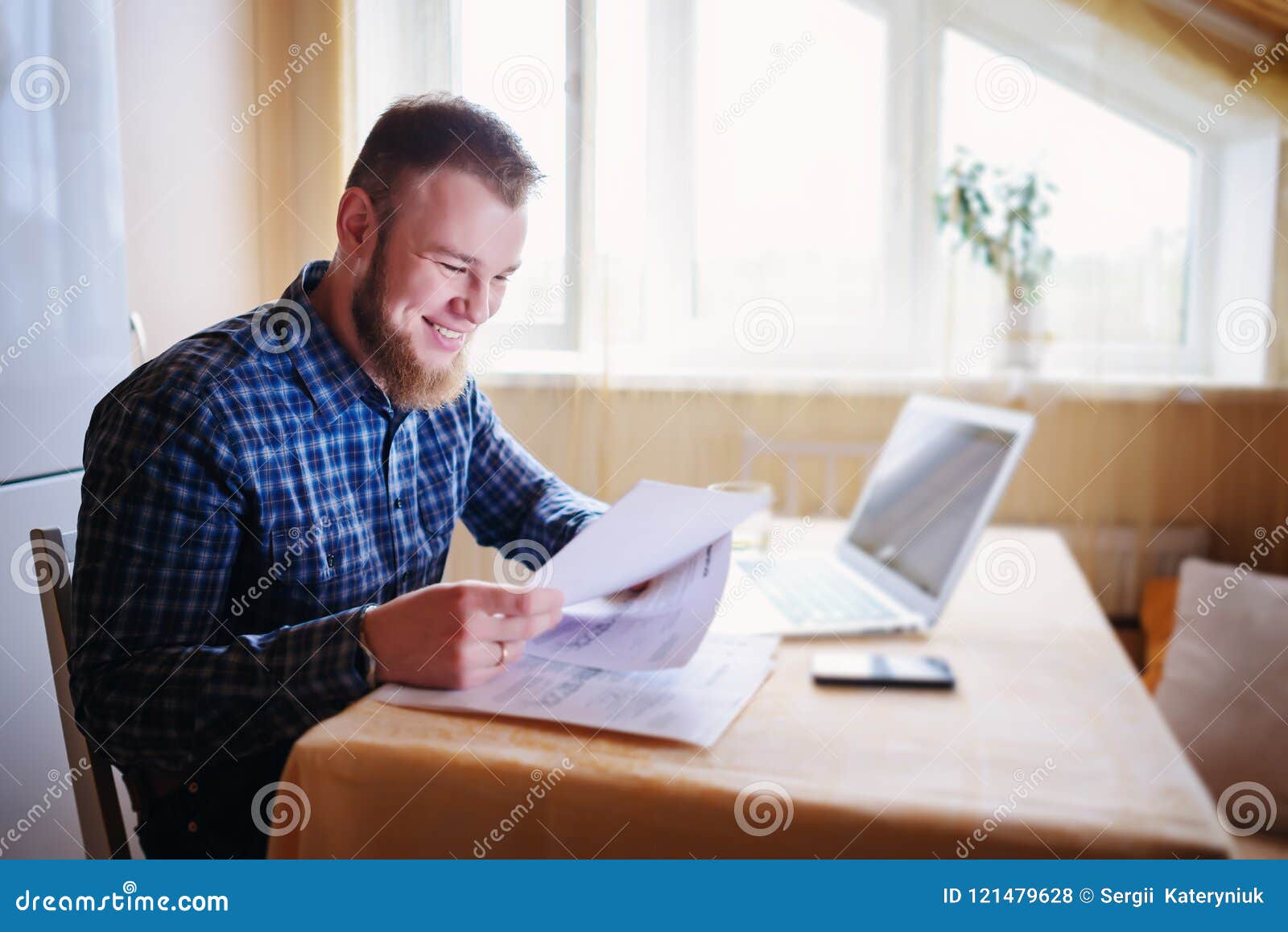 Handsome Man Doing Some Paperwork at Home Stock Photo - Image of happy ...