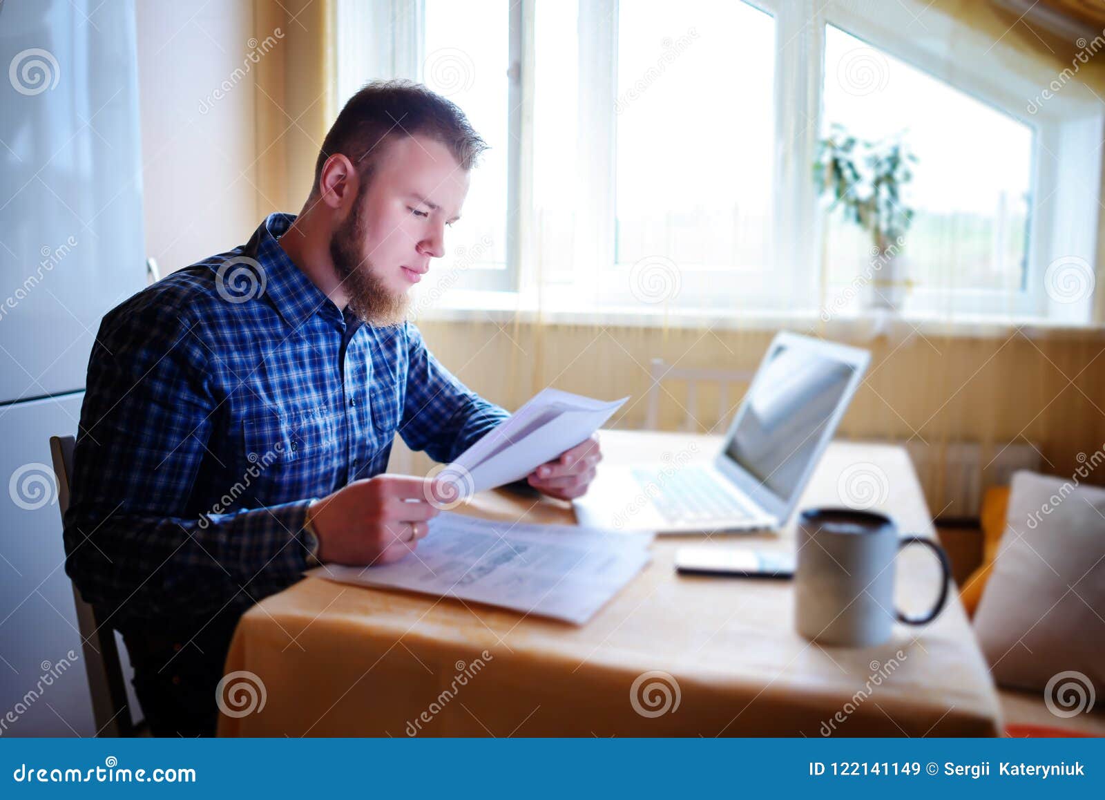 Handsome Man Doing Some Paperwork at Home Stock Image - Image of ...