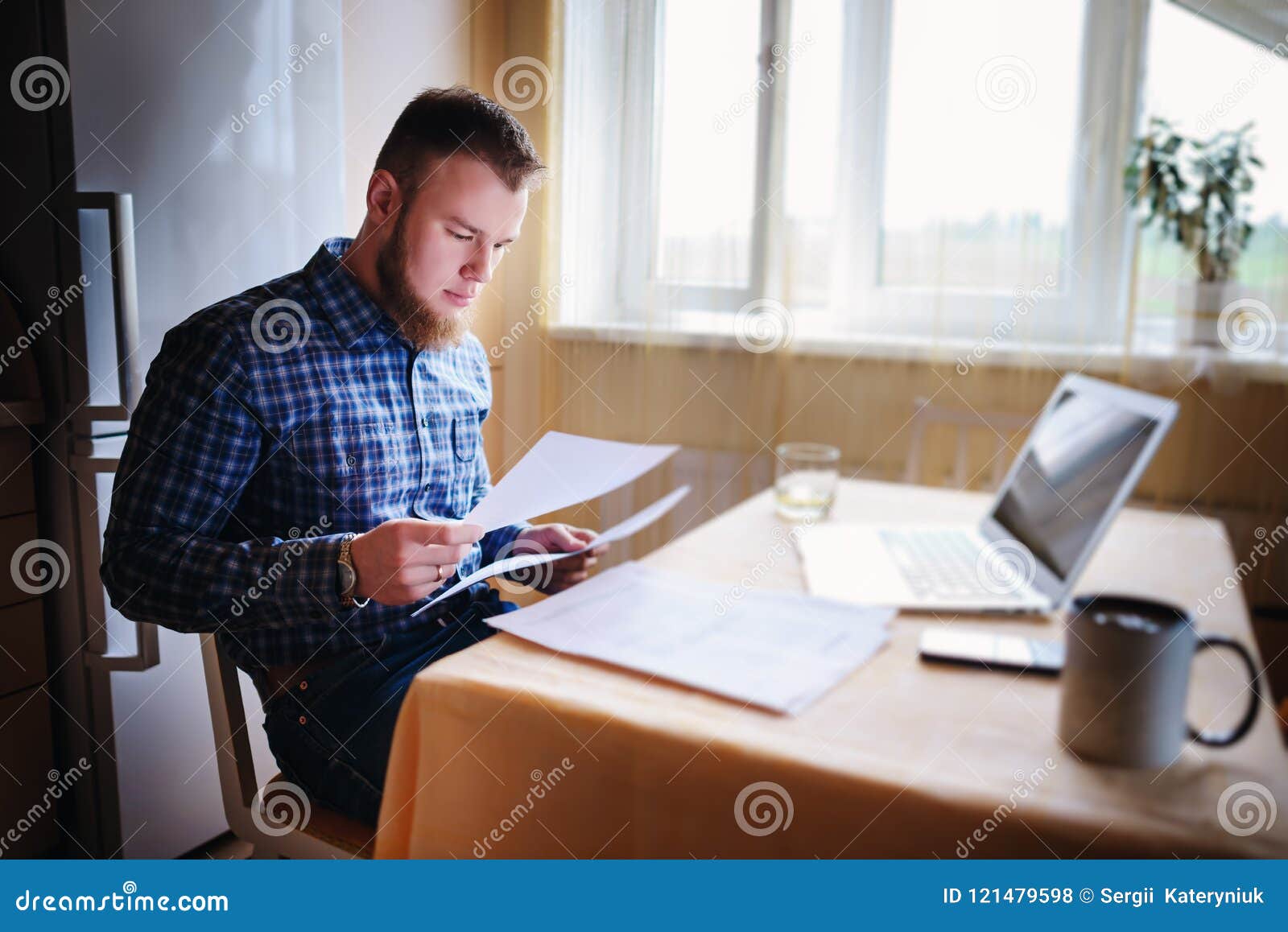Handsome Man Doing Some Paperwork at Home Stock Photo - Image of ...