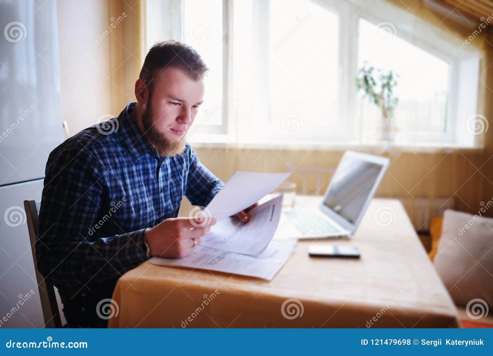 Handsome Man Doing Some Paperwork at Home Stock Photo - Image of ...