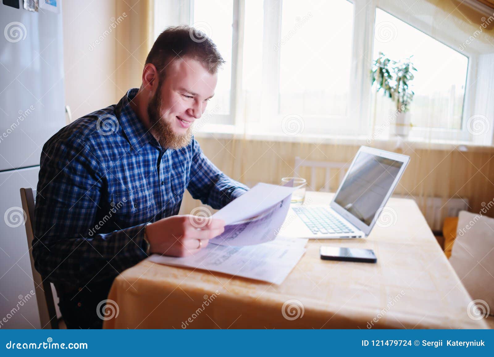 Handsome Man Doing Some Paperwork at Home Stock Photo - Image of home ...