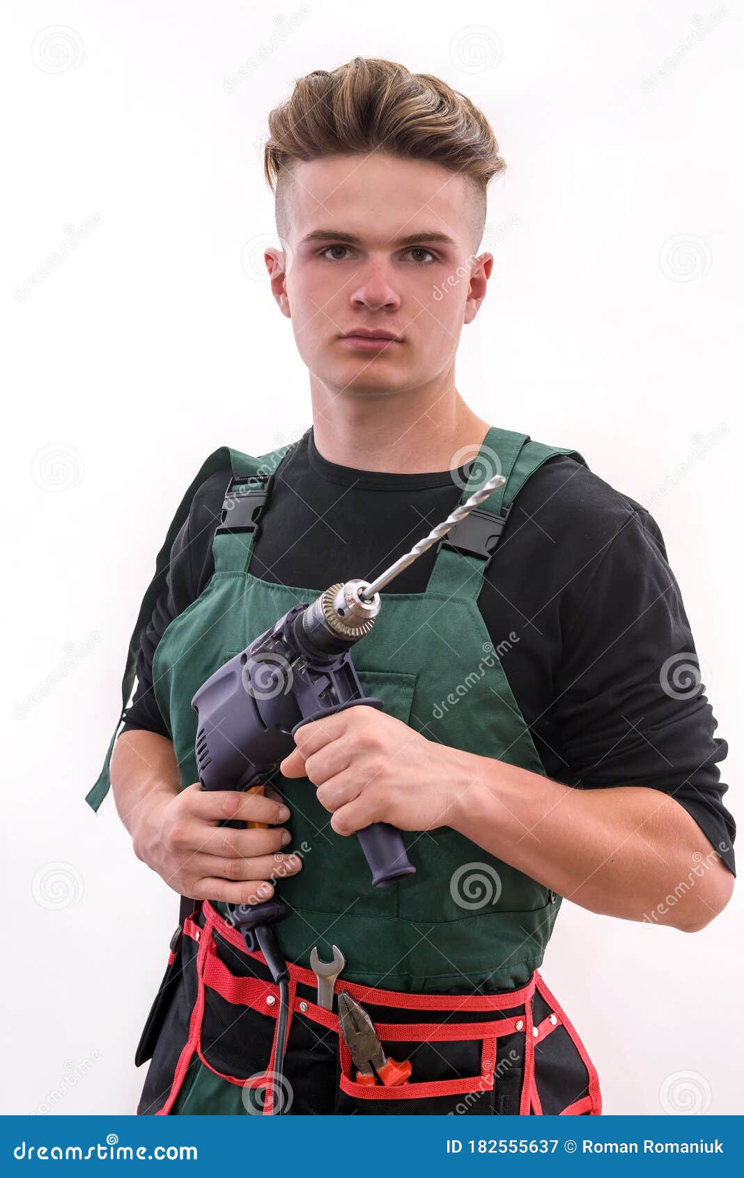 Handsome Man with Drill Machine Posing Isolated on White. Worker in ...