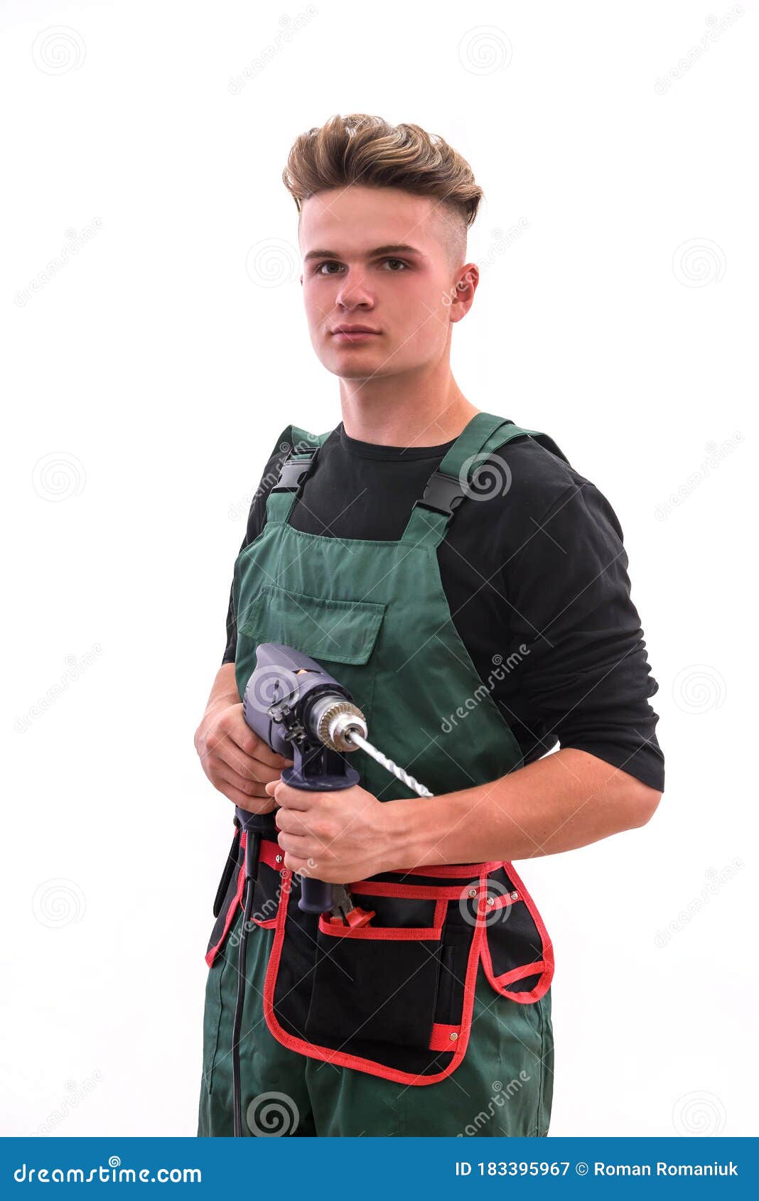 Handsome Man with Drill Machine Posing Isolated on White. Worker in ...