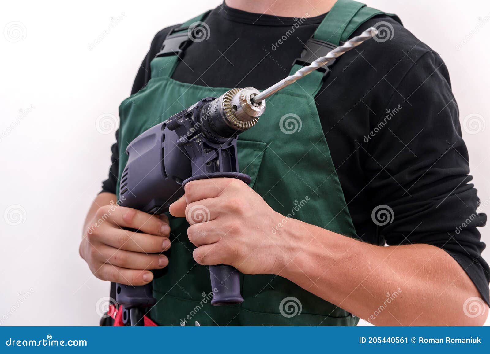 Handsome Man with Drill Machine Posing Isolated on White. Worker in ...