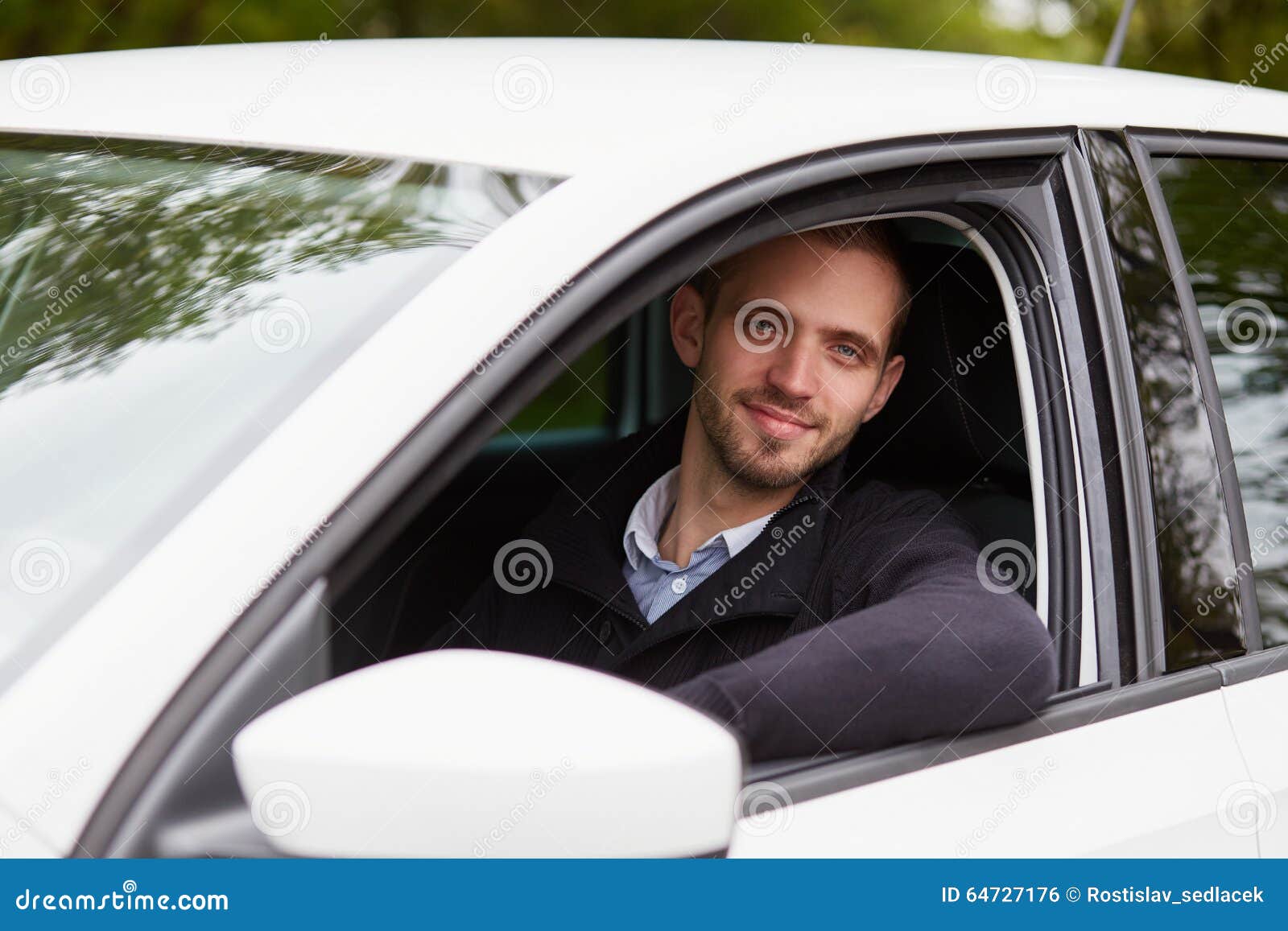 Handsome man driving car stock photo. Image of dealer - 64727176