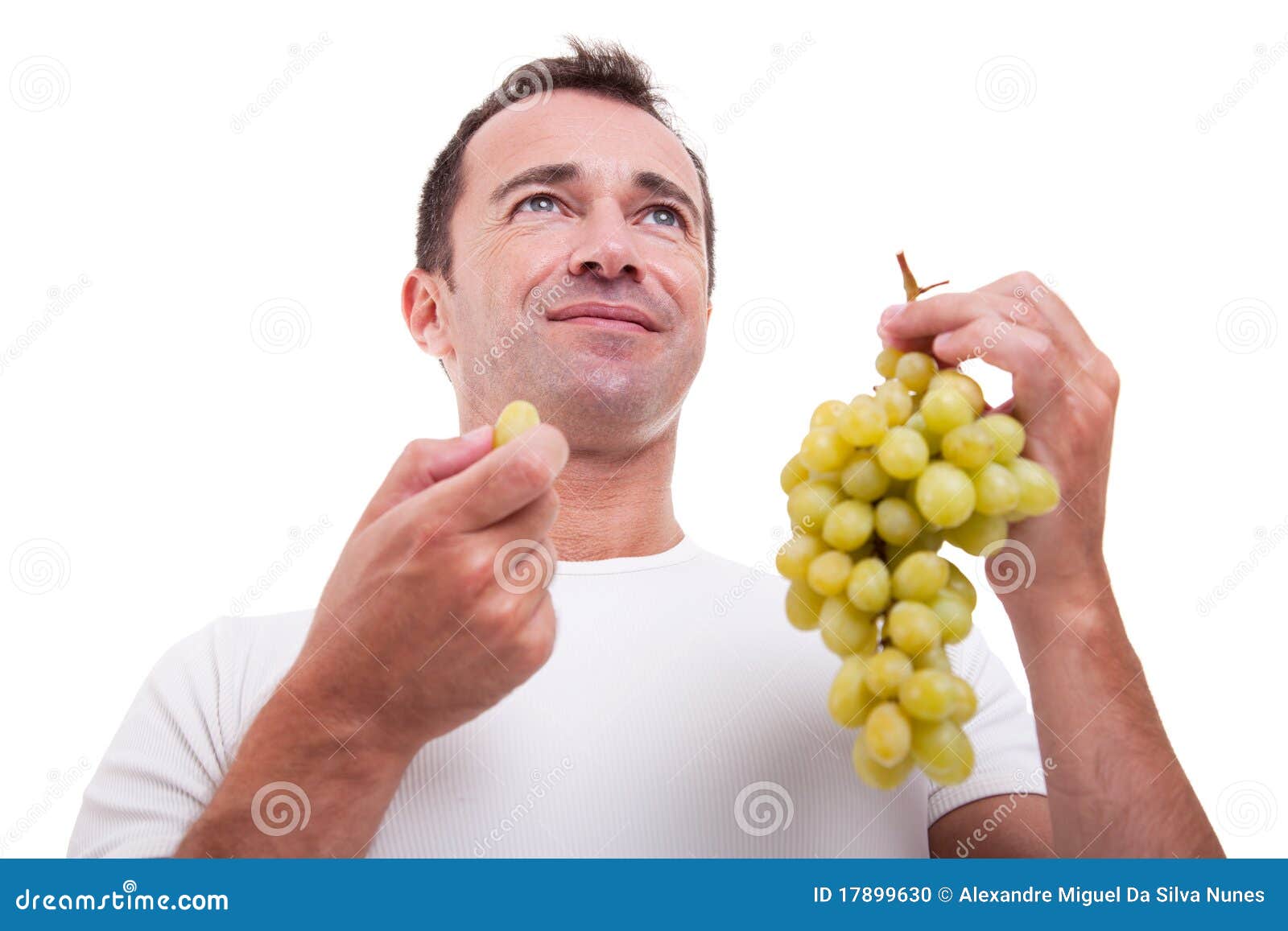Handsome Man Eating a Green Grapes, Stock Photo - Image of dessert ...
