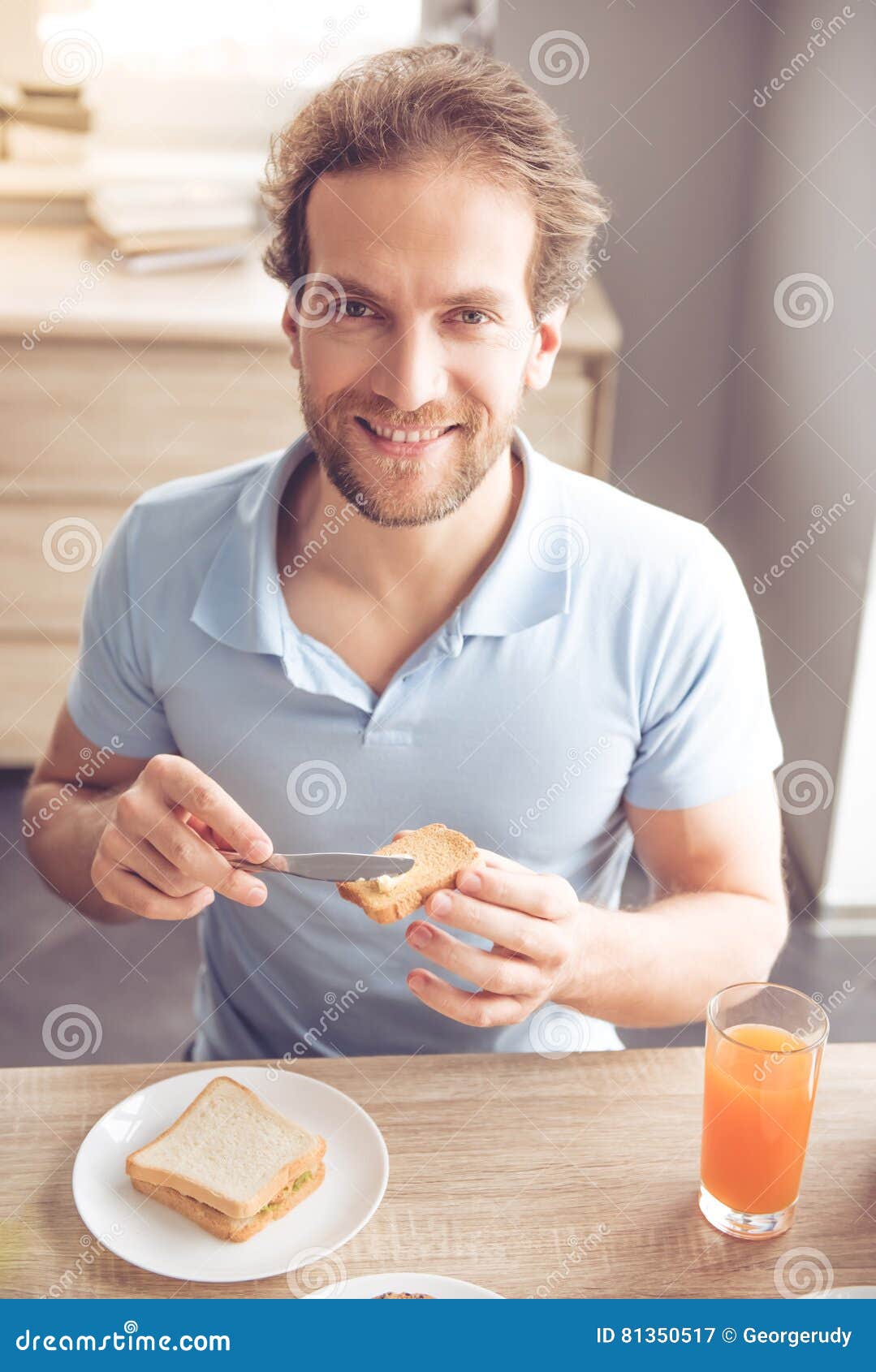 Handsome man eating stock image. Image of orange, little - 81350517