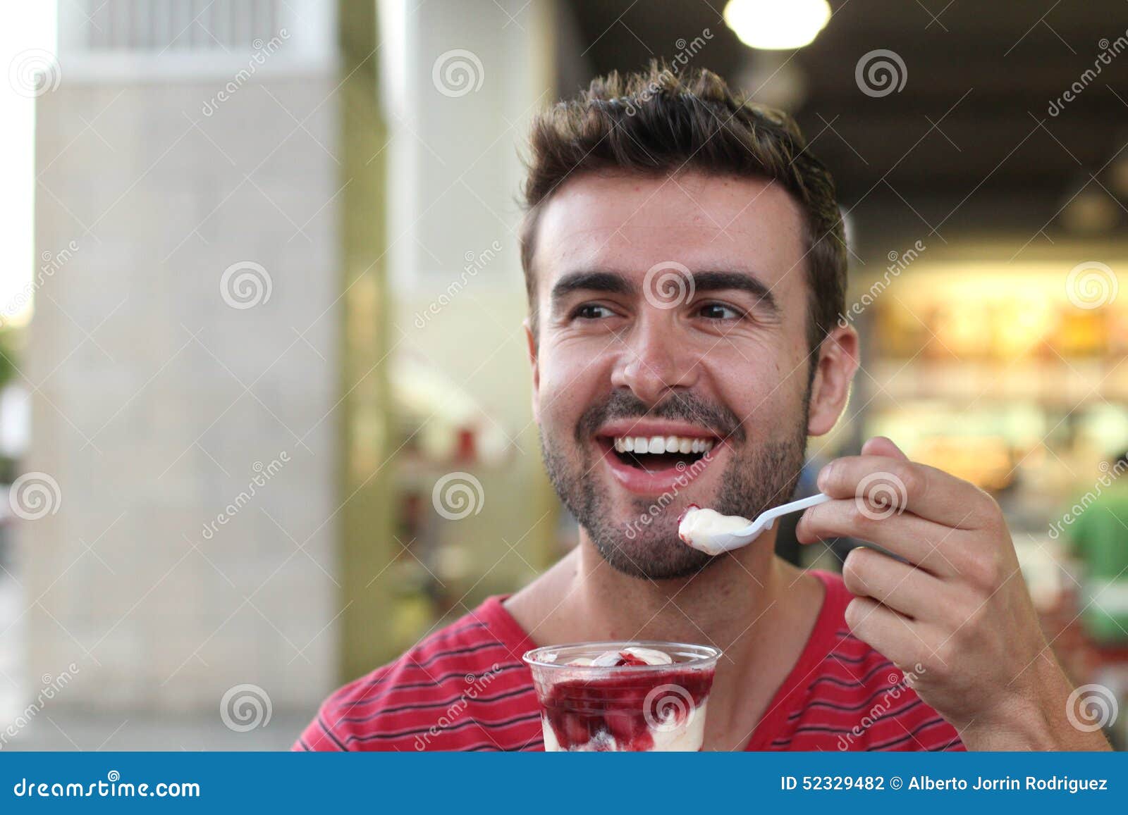 Handsome Man Eating a Yummy Ice Cream Stock Photo - Image of colorful ...