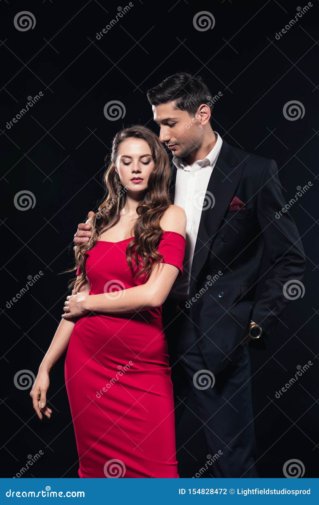 Handsome Man Embracing Beautiful Woman In Red Dress Isolated Stock