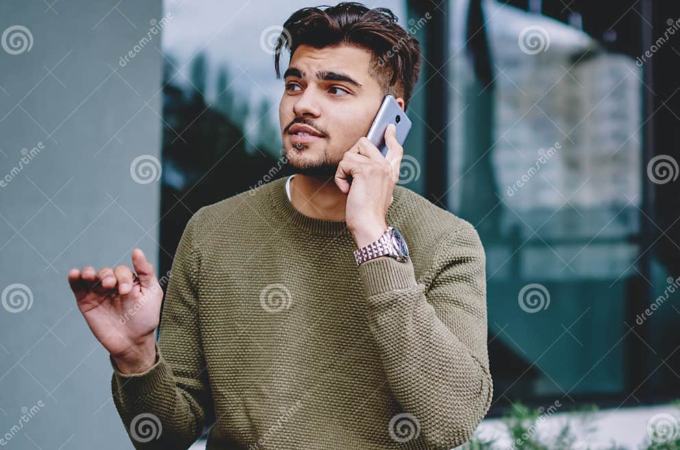 Handsome Man Explaining Information during Telephone Conversation ...